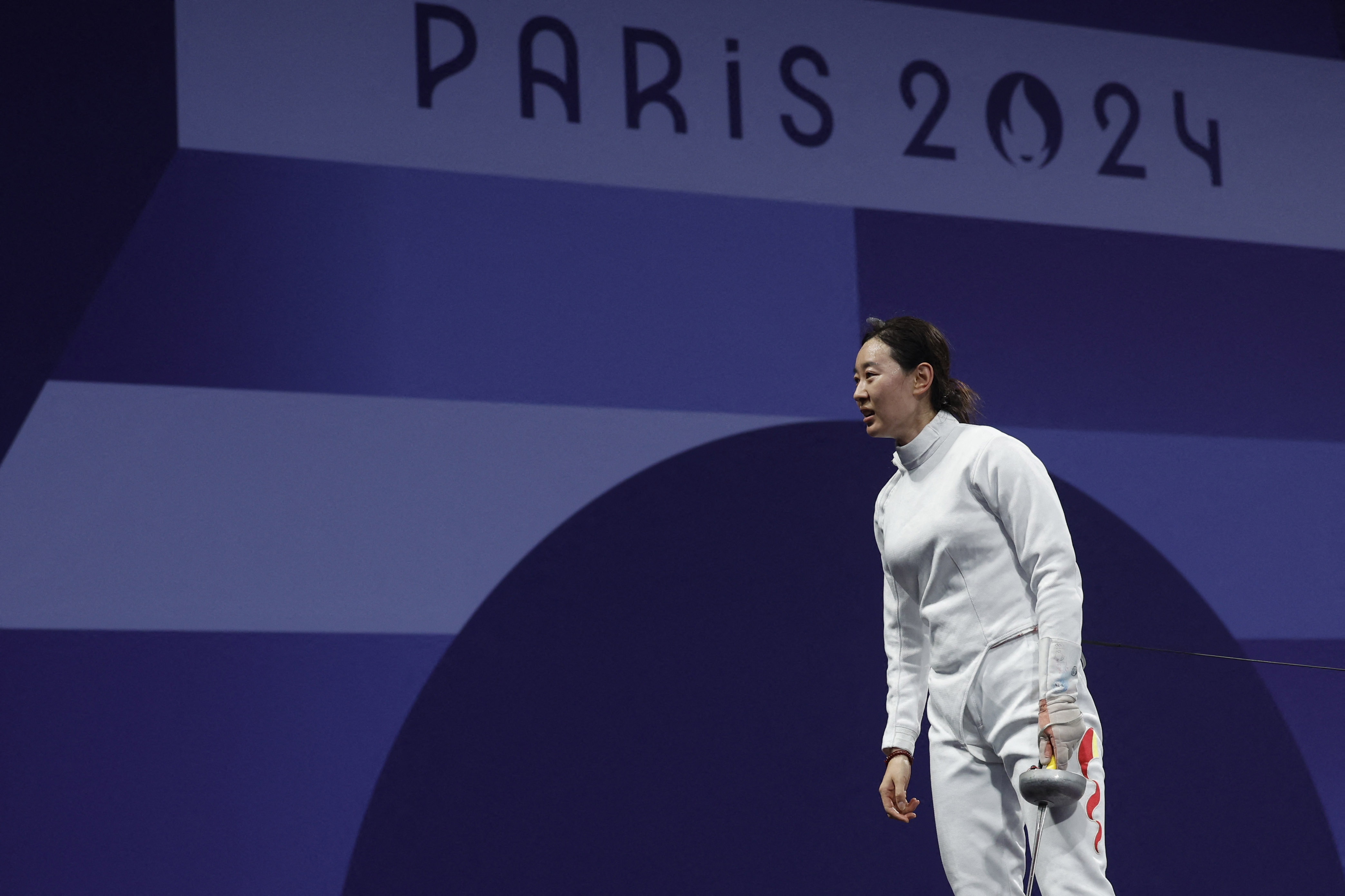 Defending champion fencer Sun Yiwen defeated in sudden-death epee shock | Reuters