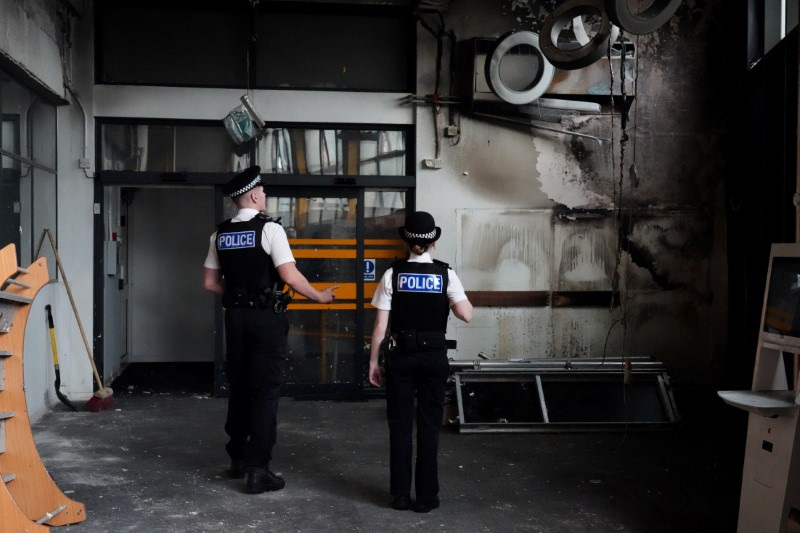 'Fight back': Wrecked Liverpool library stands defiant against UK riots ...