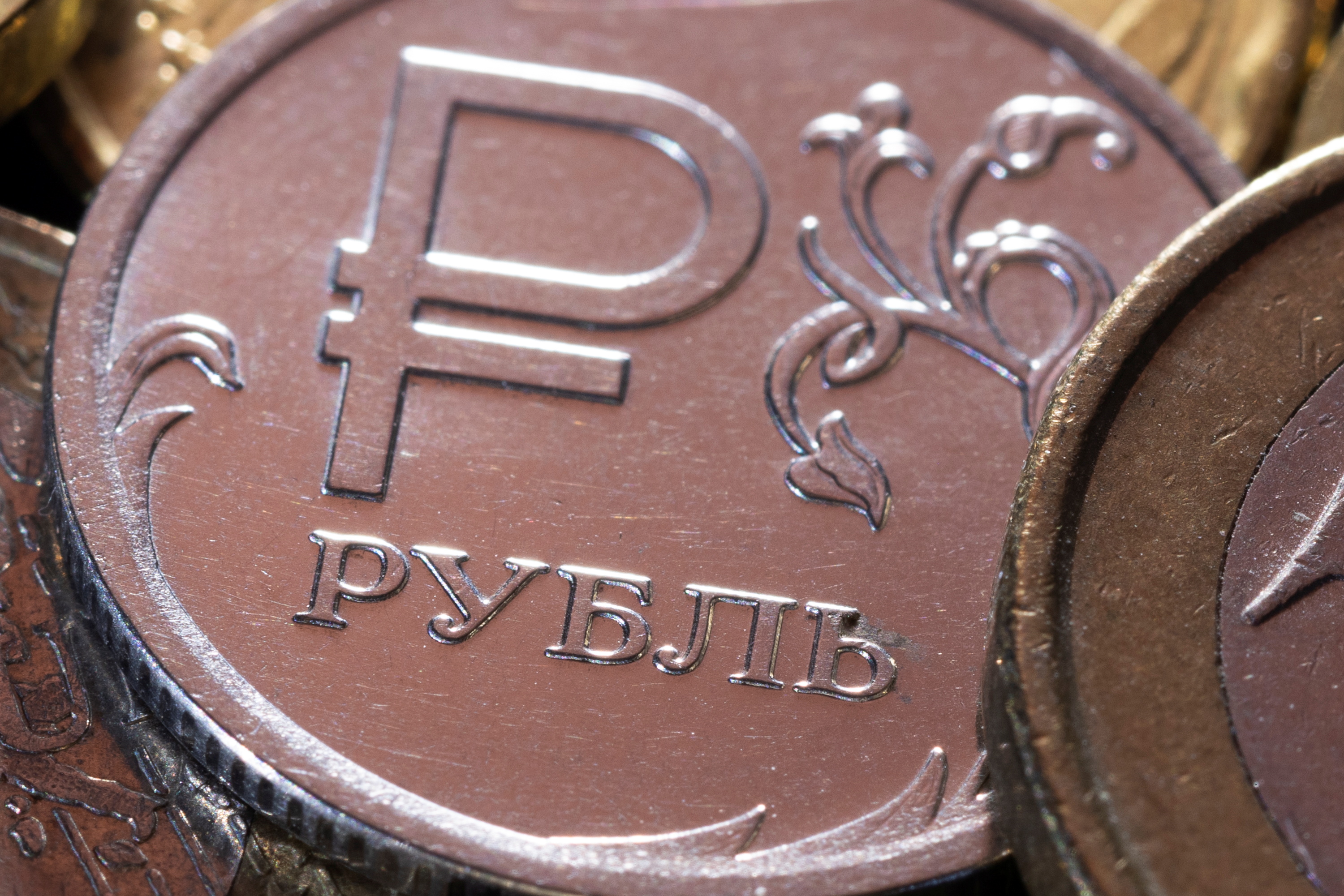 Russian rouble surges past 67 vs dollar, stocks mixed | Reuters