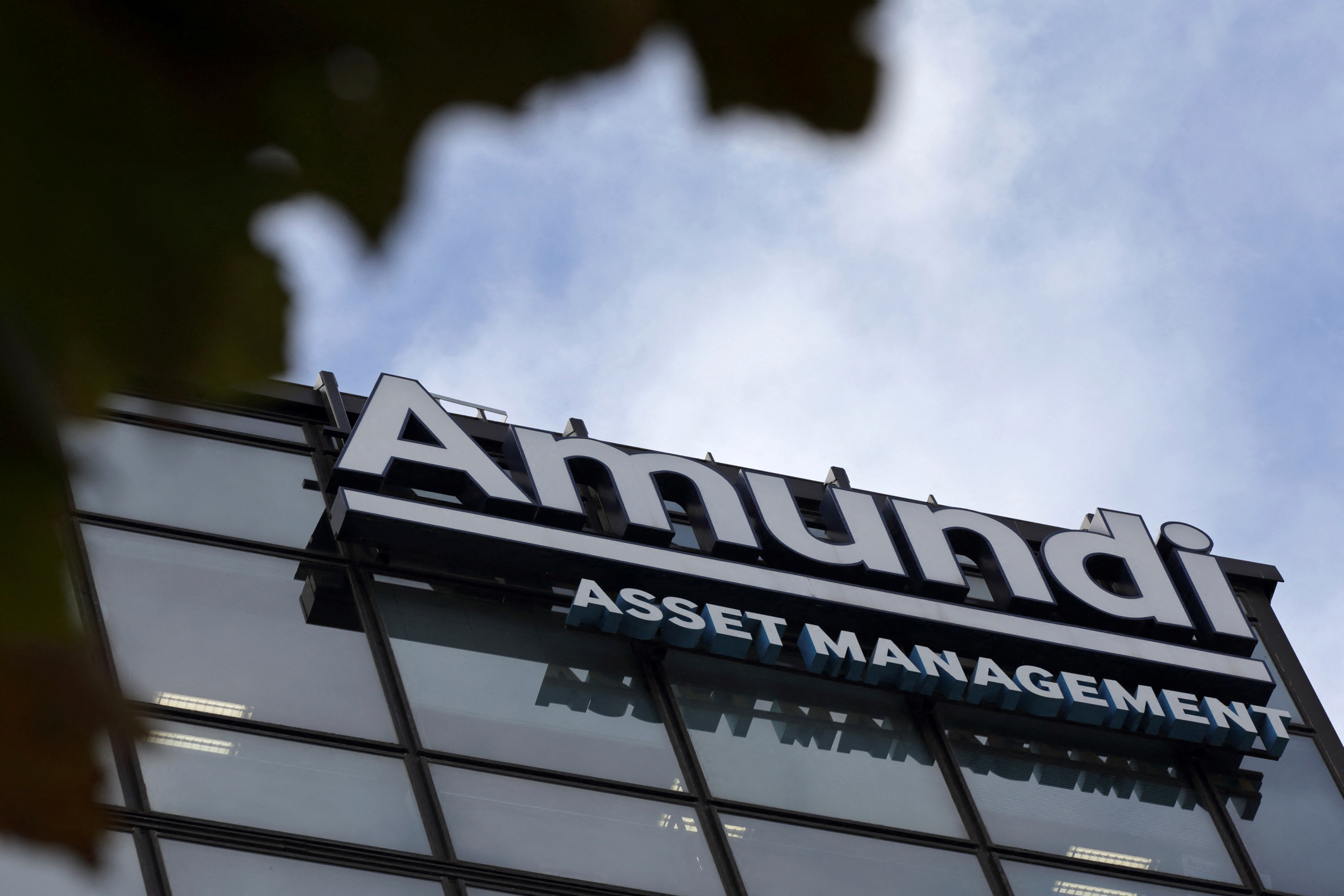 Amundi cuts EU sustainability grade of 100 funds | Reuters