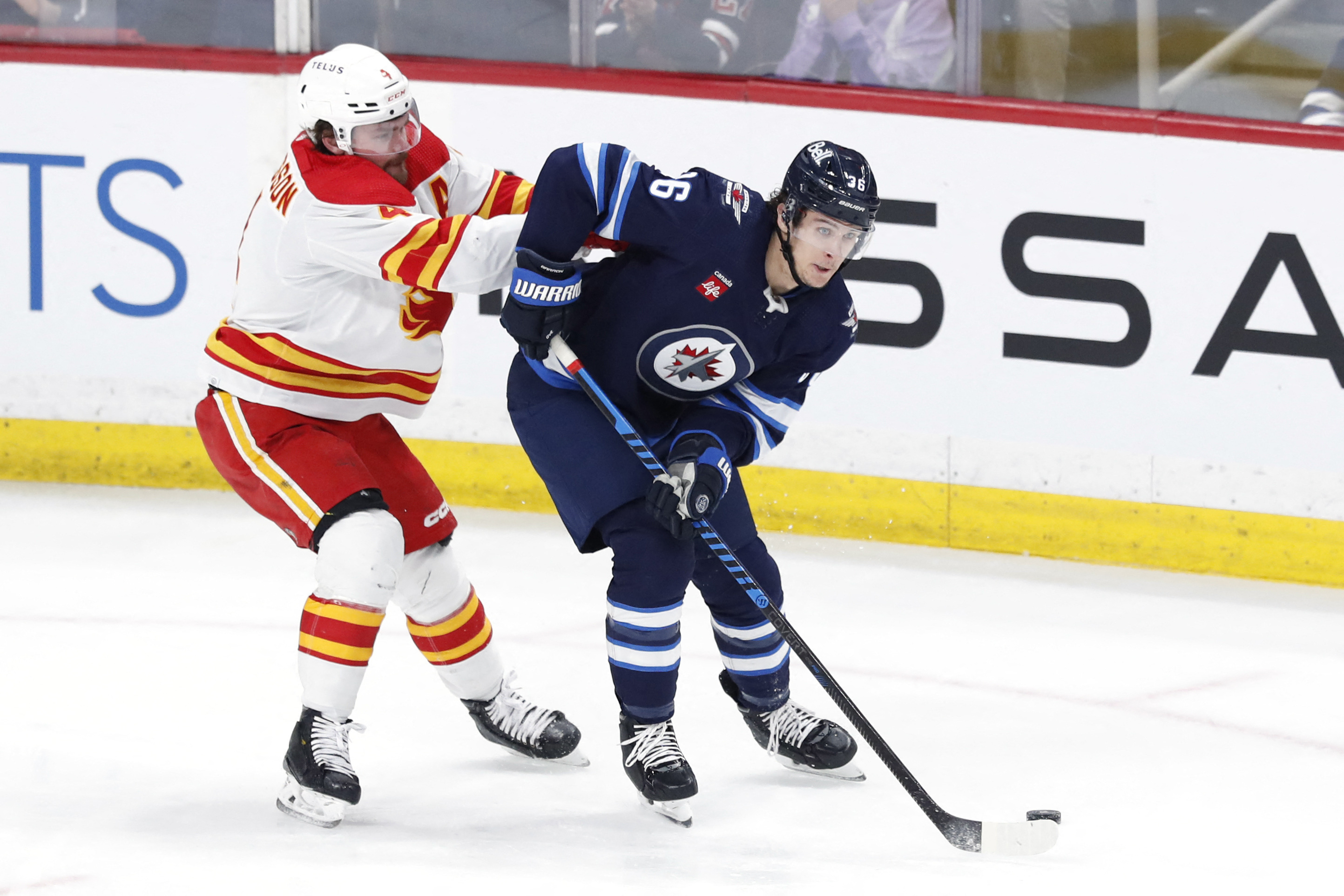 Jets douse Flames, clinch playoff berth | Reuters
