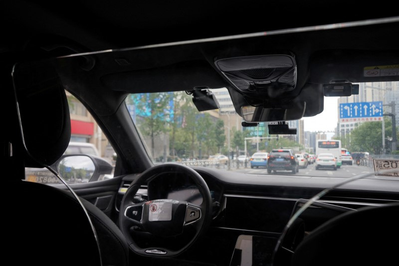 China's drivers fret as robotaxis pick up pace - and passengers | Reuters