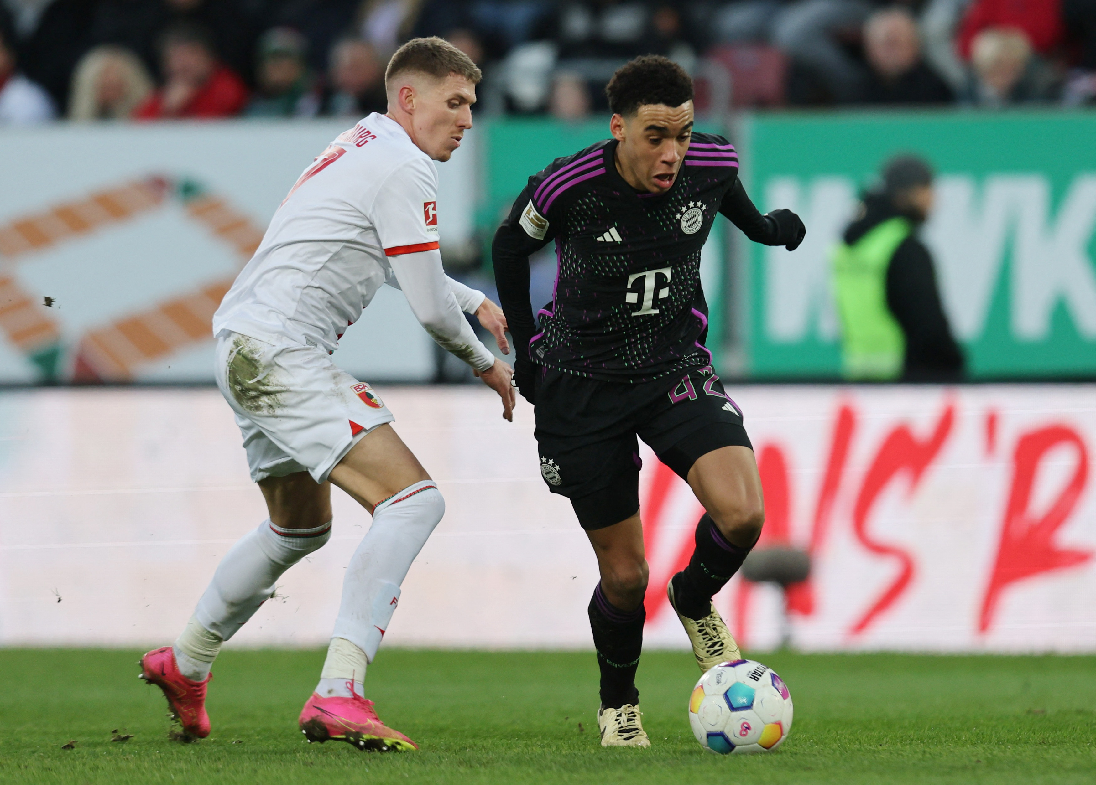 Bayern win 3-2 at Augsburg to close on leaders Leverkusen | Reuters