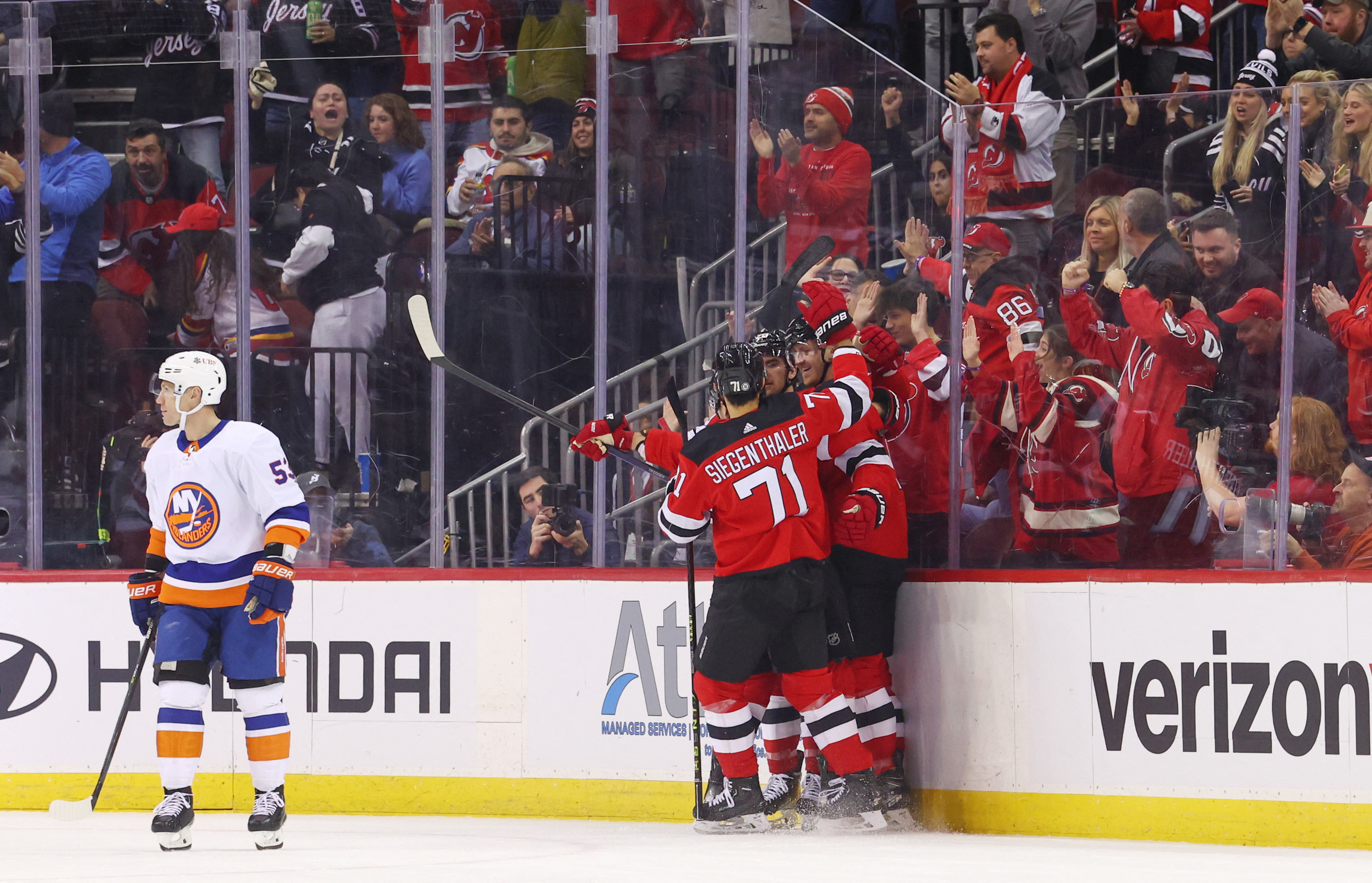 Devils score three times in third period to stun Islanders | Reuters