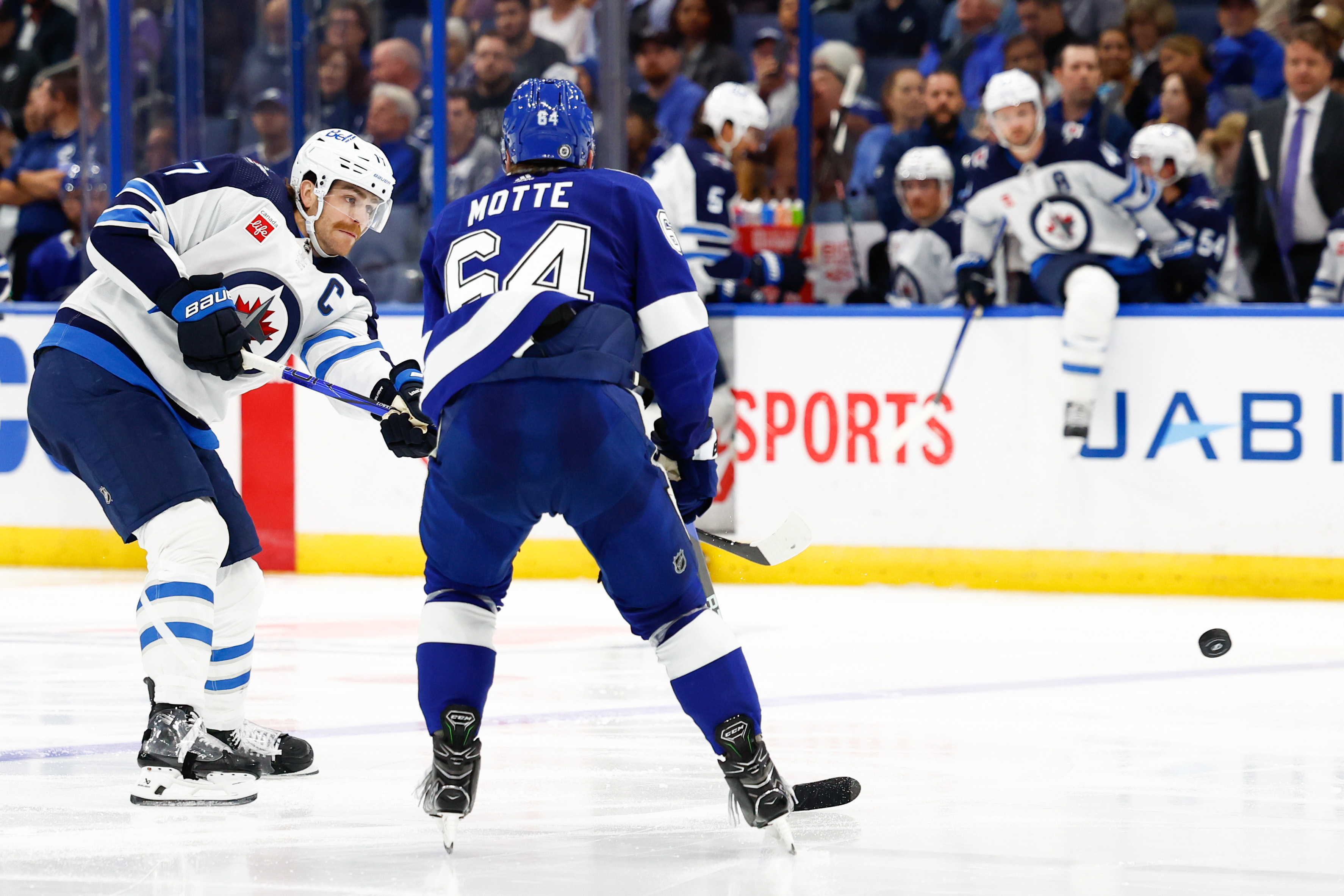 Adam Lowry leads Jets past Lightning in overtime | Reuters