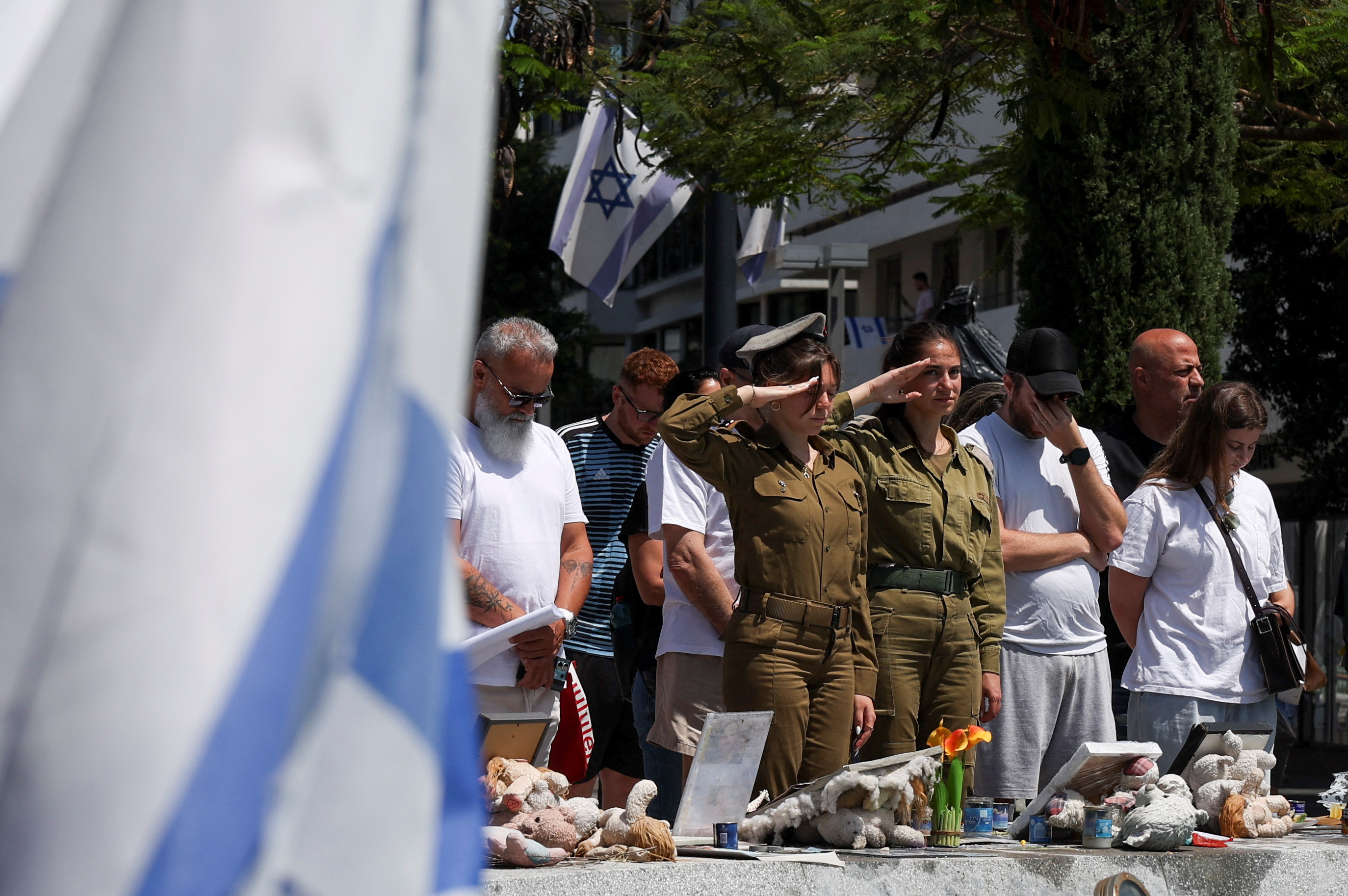 Sirens sound for the dead and for rockets on Israeli Memorial Day | Reuters