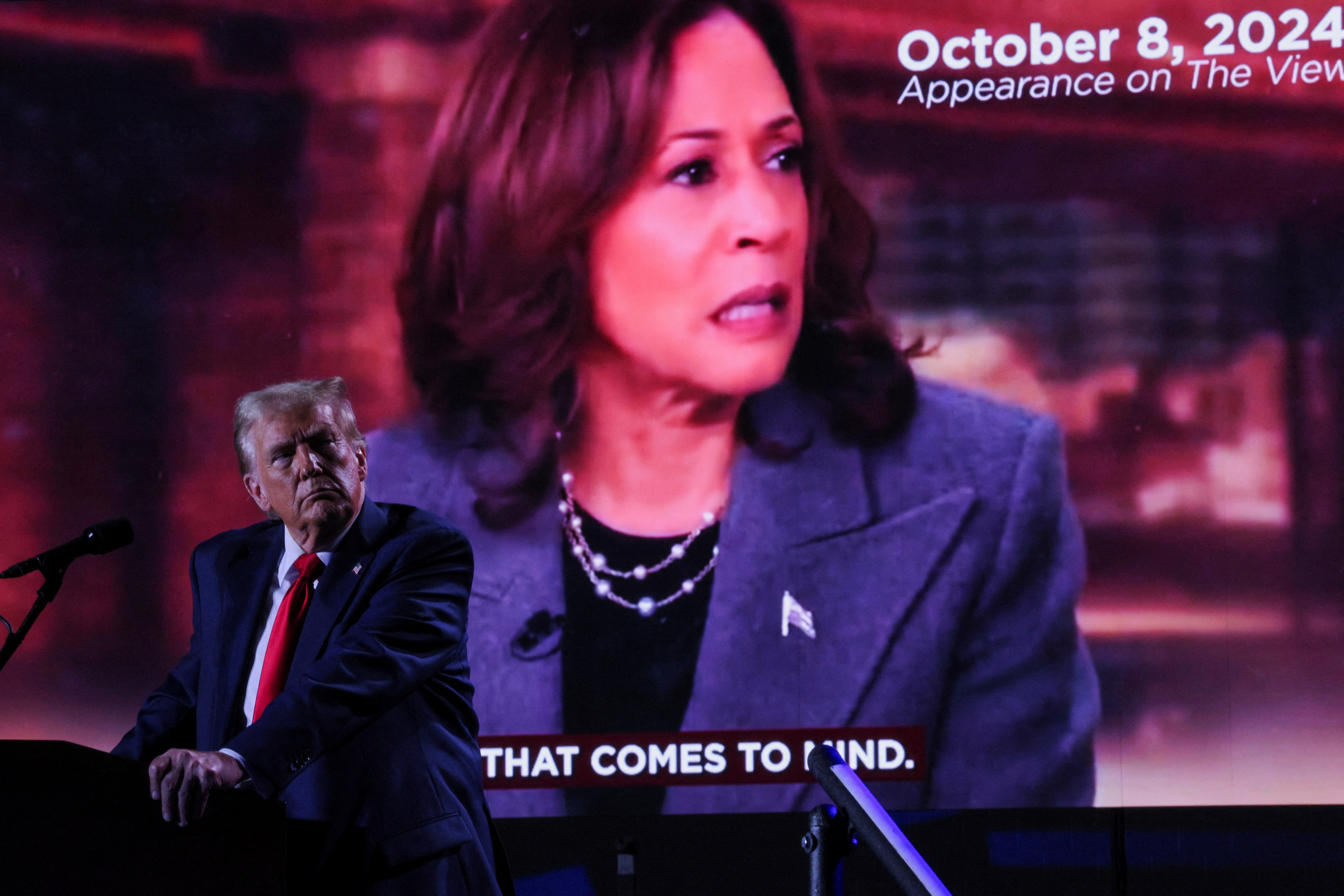 Trump steps up attacks on Harris; Usher, Lizzo add star power to Harris ...