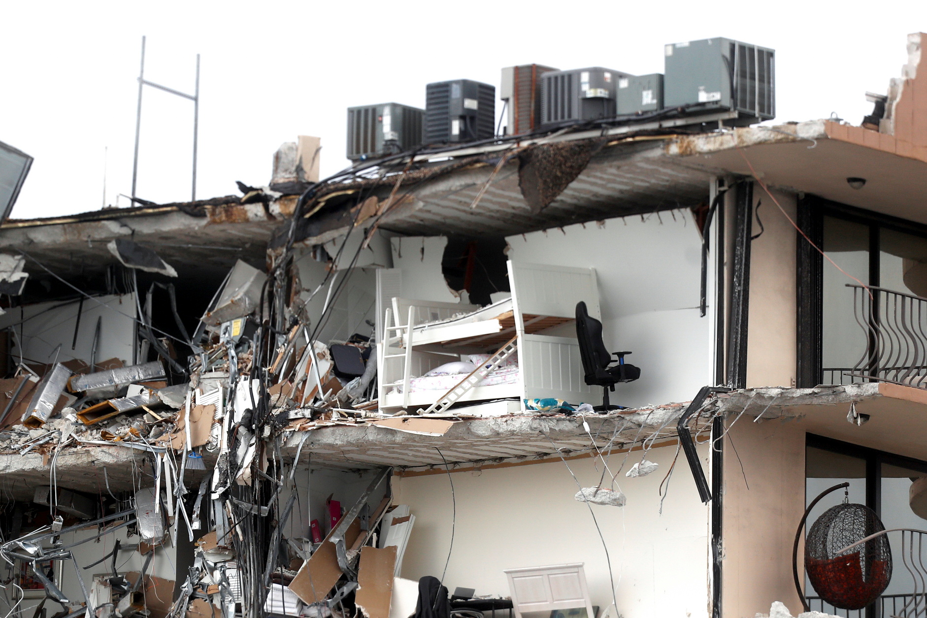 Rescue workers, families cling to hope for survivors of Florida ...