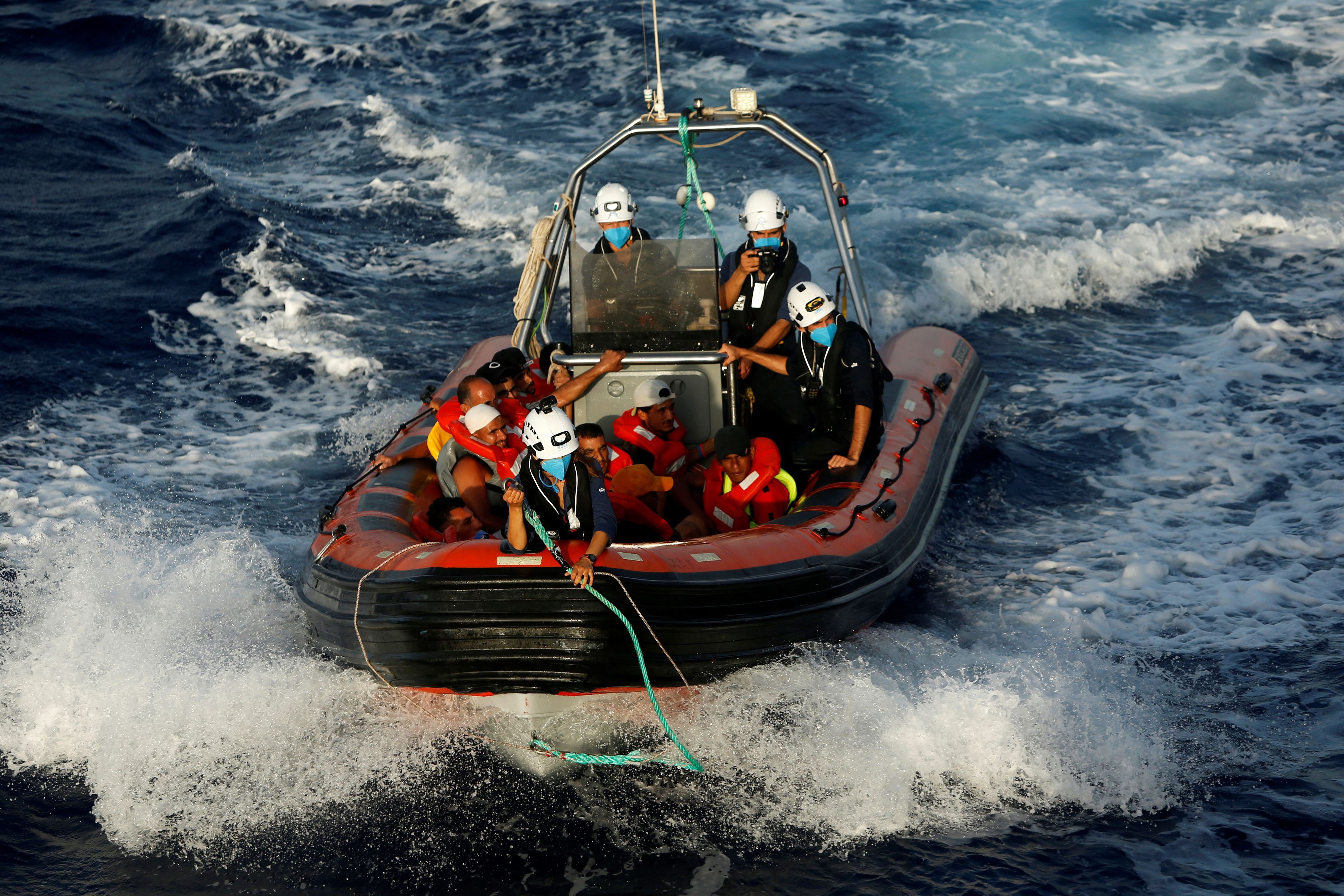 Rescuers pull 394 migrants from dangerously overcrowded boat off ...