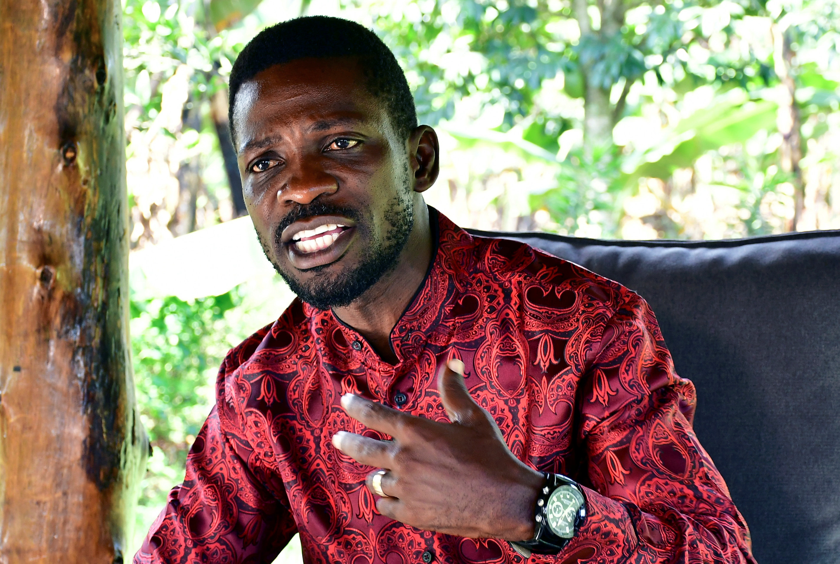 Ugandan presidential challenger Bobi Wine campaigns in a flak jacket ...