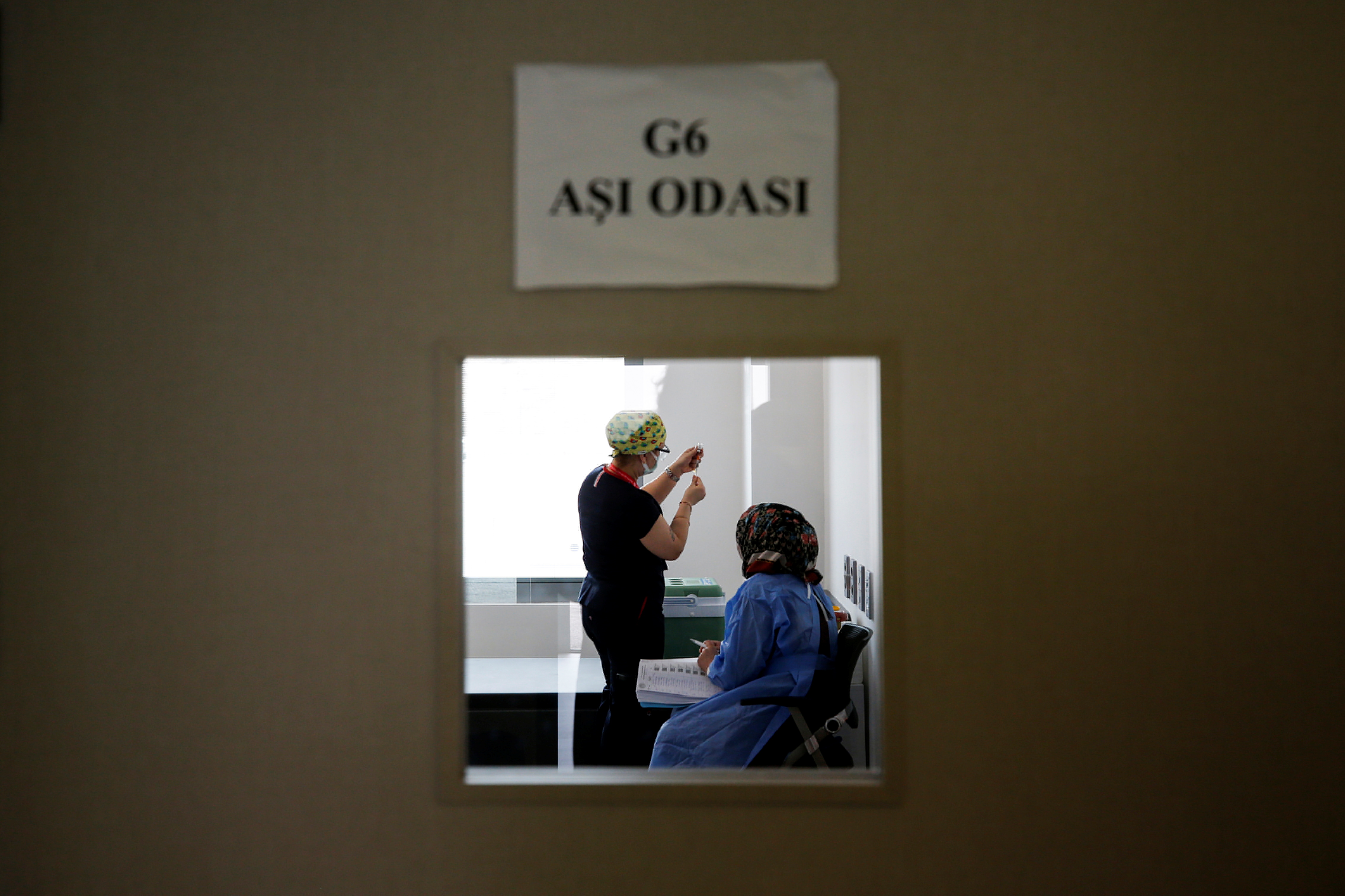 Turkey begins administering Pfizer/BioNTech COVID-19 shots | Reuters