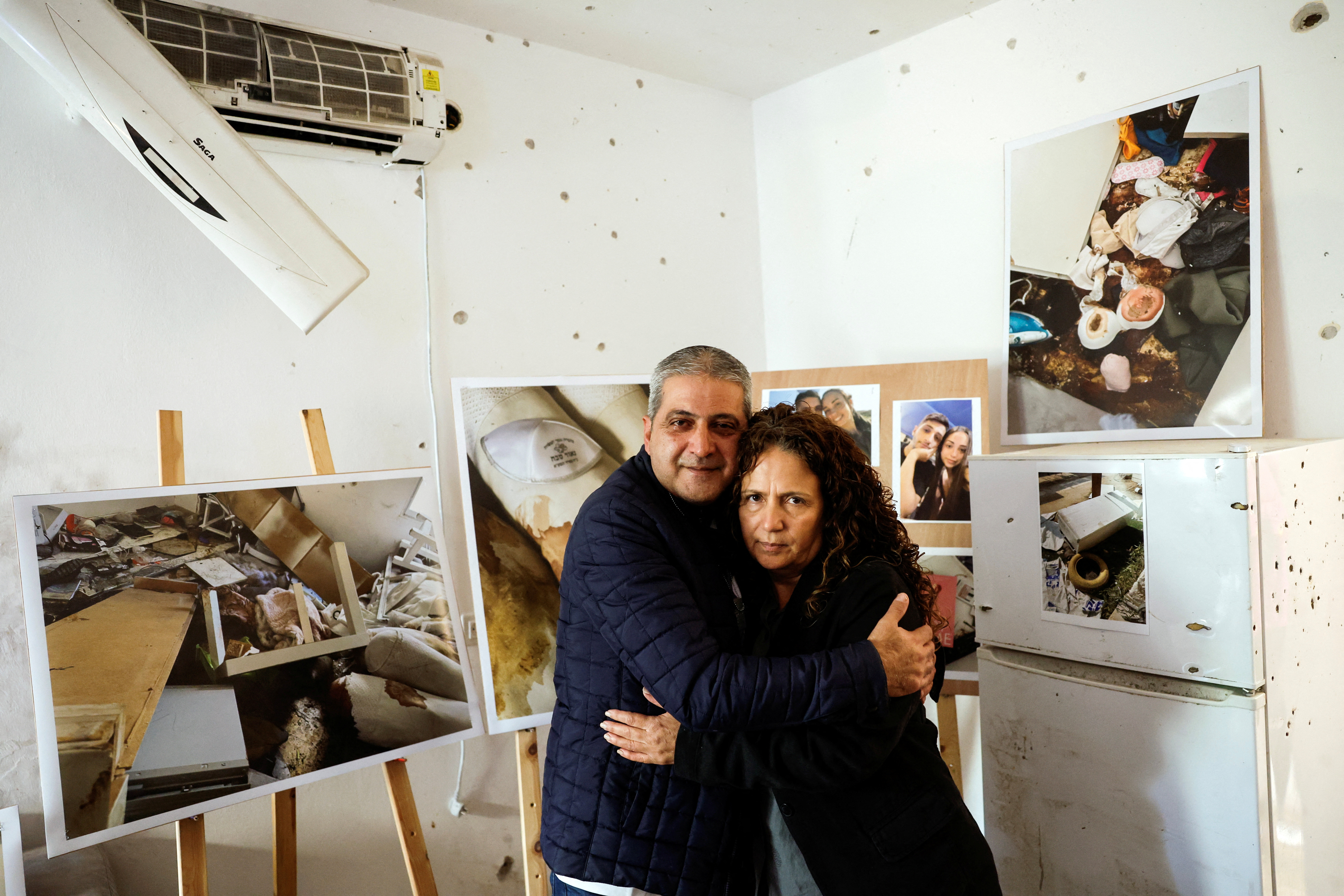 Israeli parents grieve in flat full of memories and bullet holes | Reuters