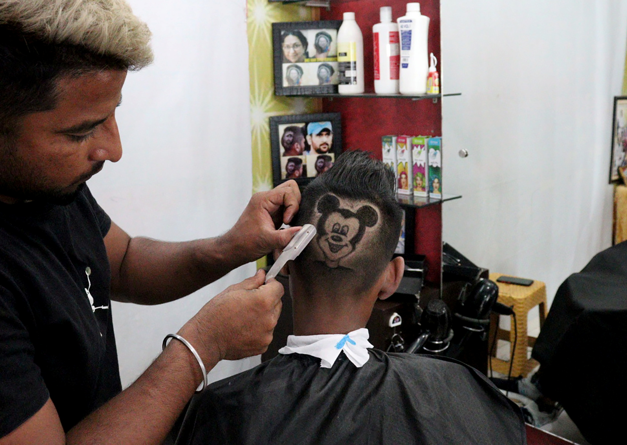 Indian barber siblings turn heads into canvasses by giving unusual ...