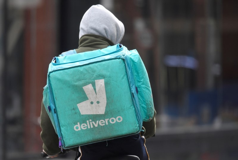 Deliveroo reaches net profit and cash flow milestones | Reuters