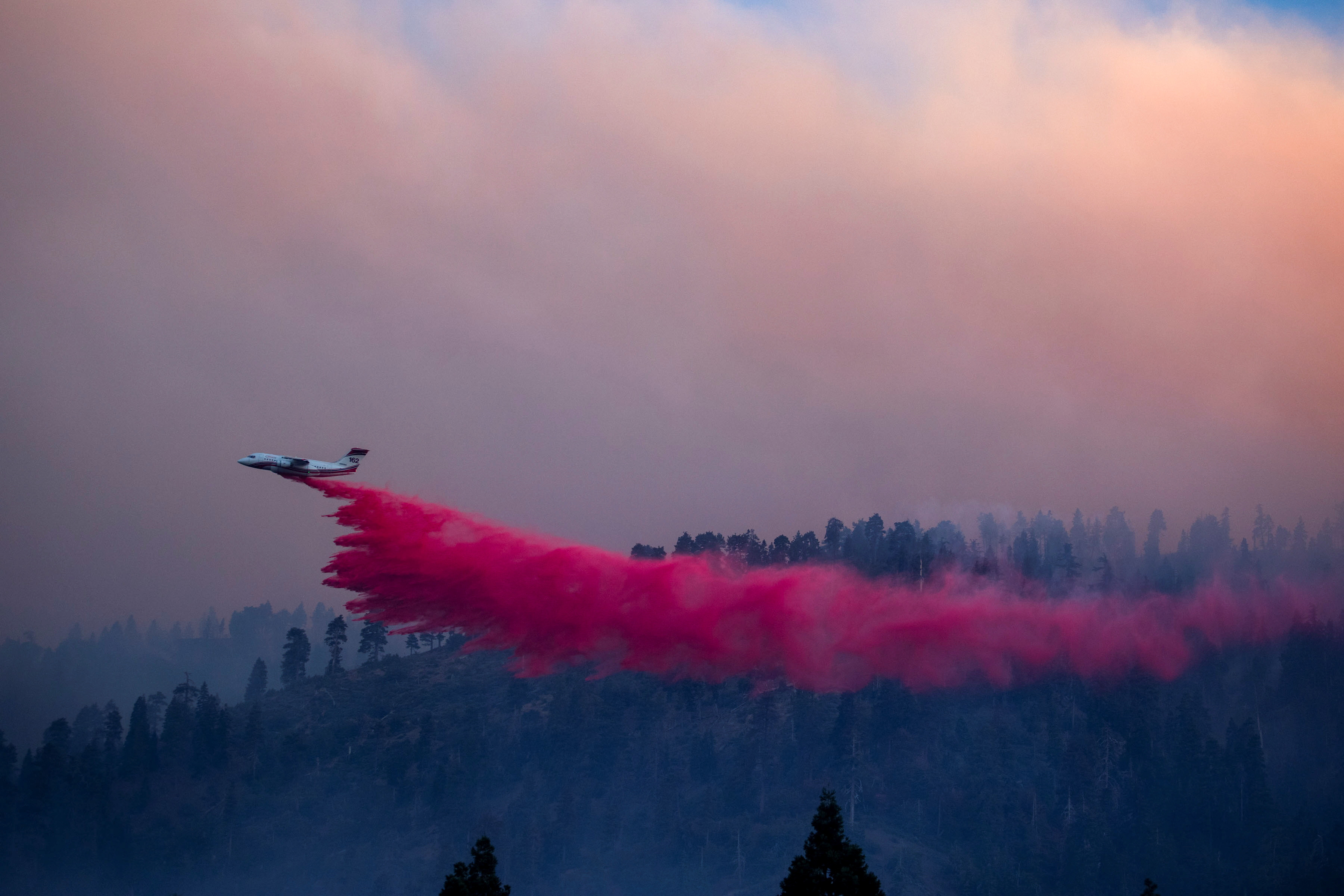 In pictures: California wildfires burn dozens of homes, ski resort ...