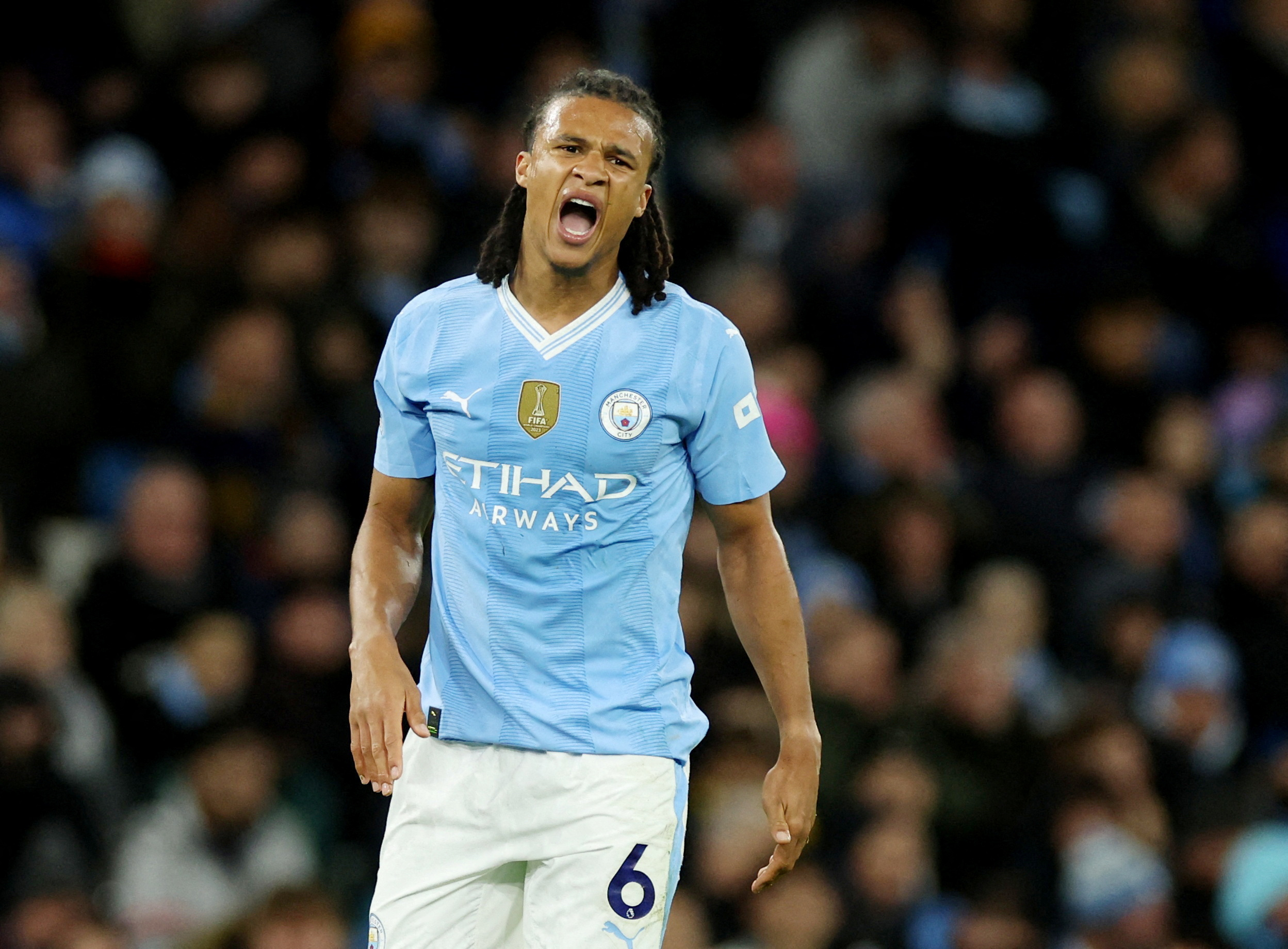 Man City's Ake strikes a chord in school piano project | Reuters