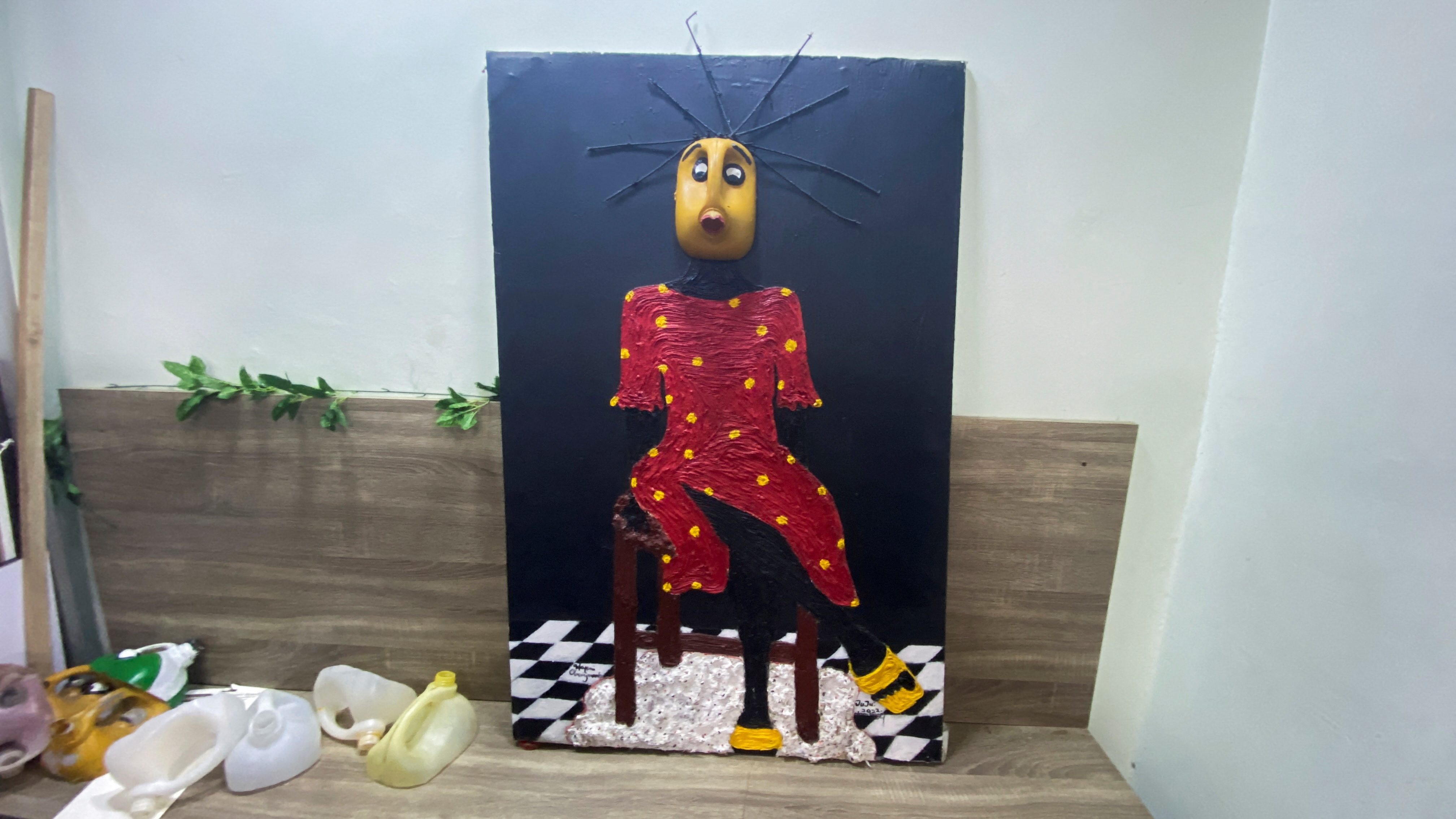 Nigeria artist transforms oil kegs into faces to reduce waste | Reuters