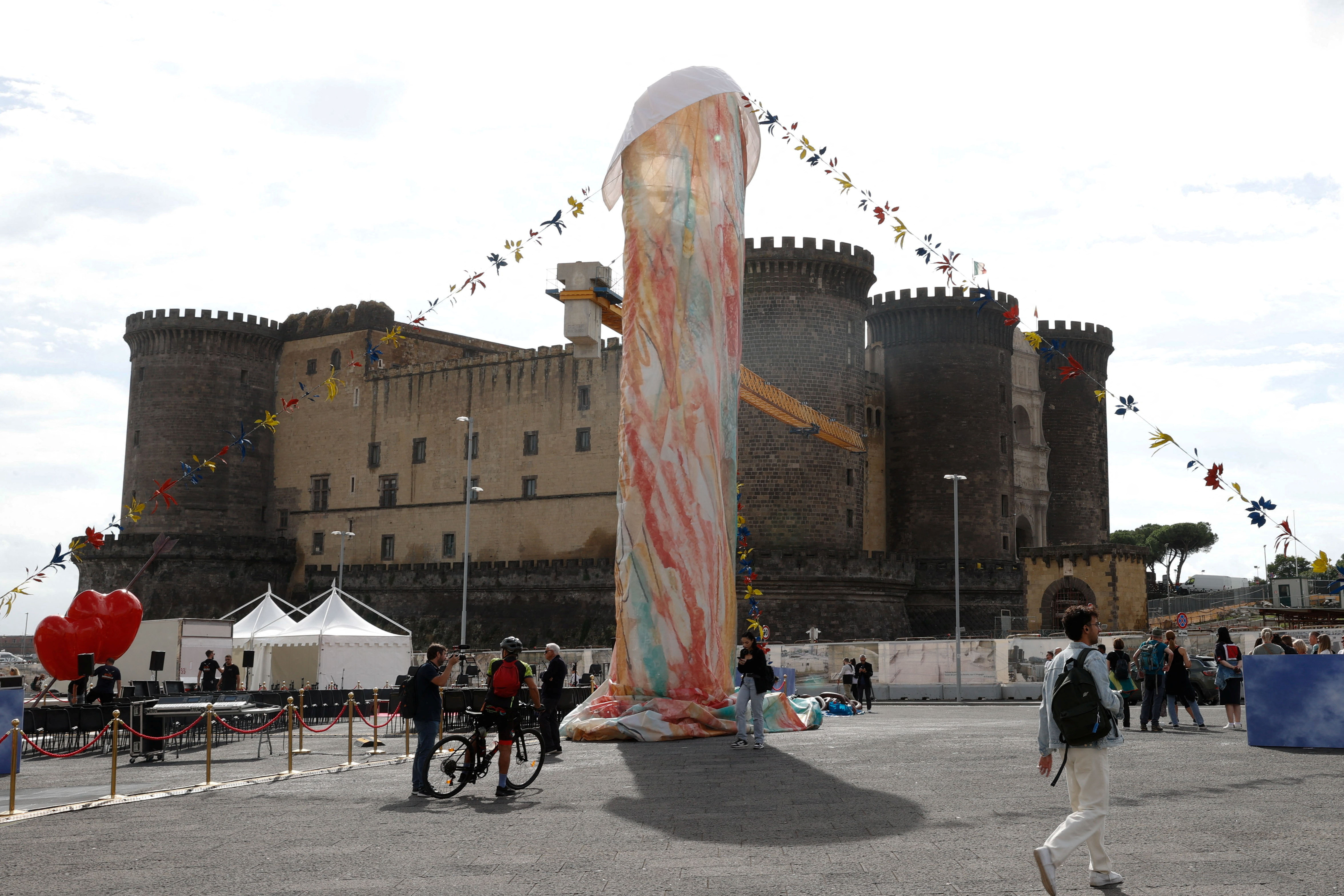 Phallic 12-metre art installation raises eyebrows in Naples | Reuters