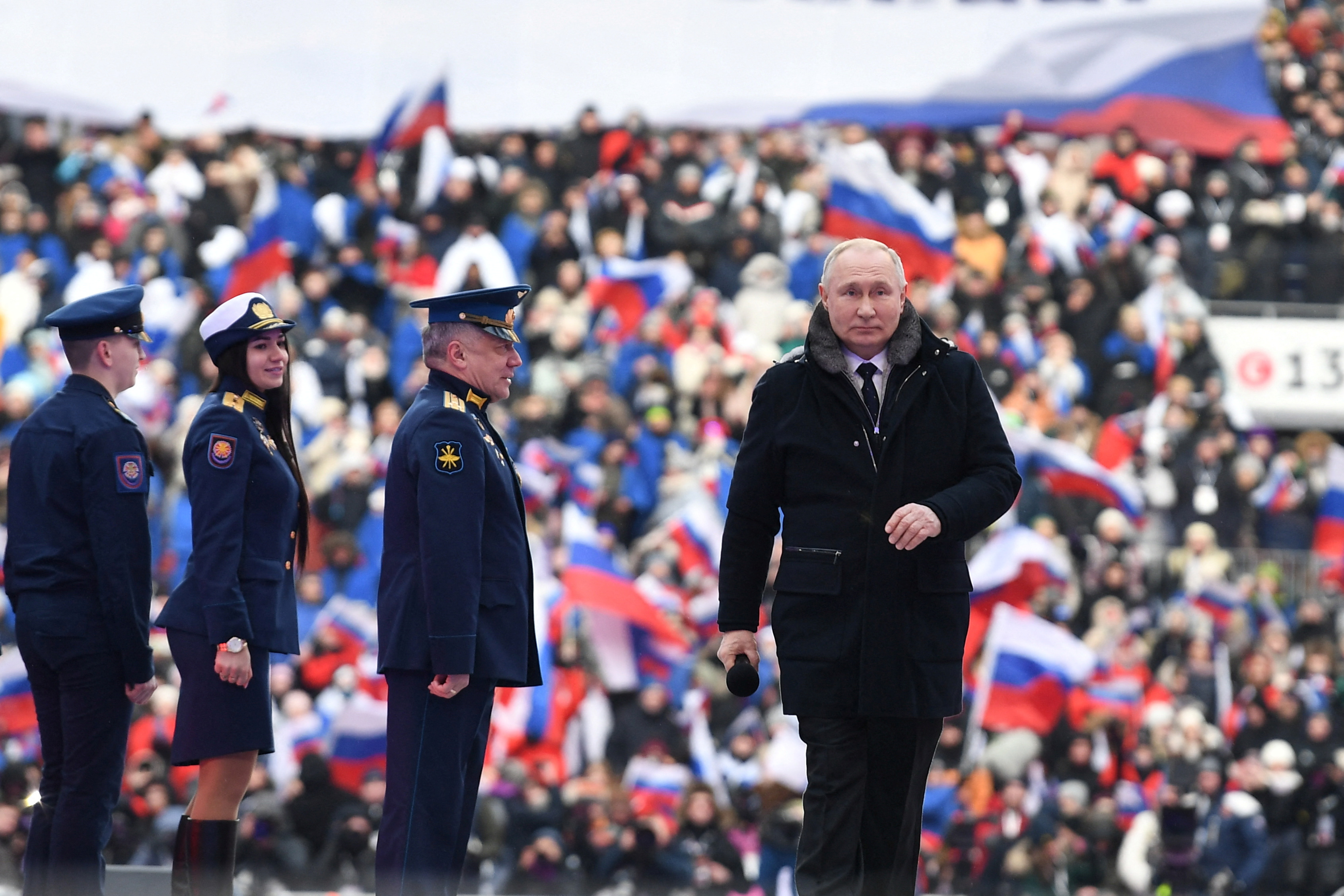 Putin hails Russia's fighters in Ukraine at rally in Moscow | Reuters