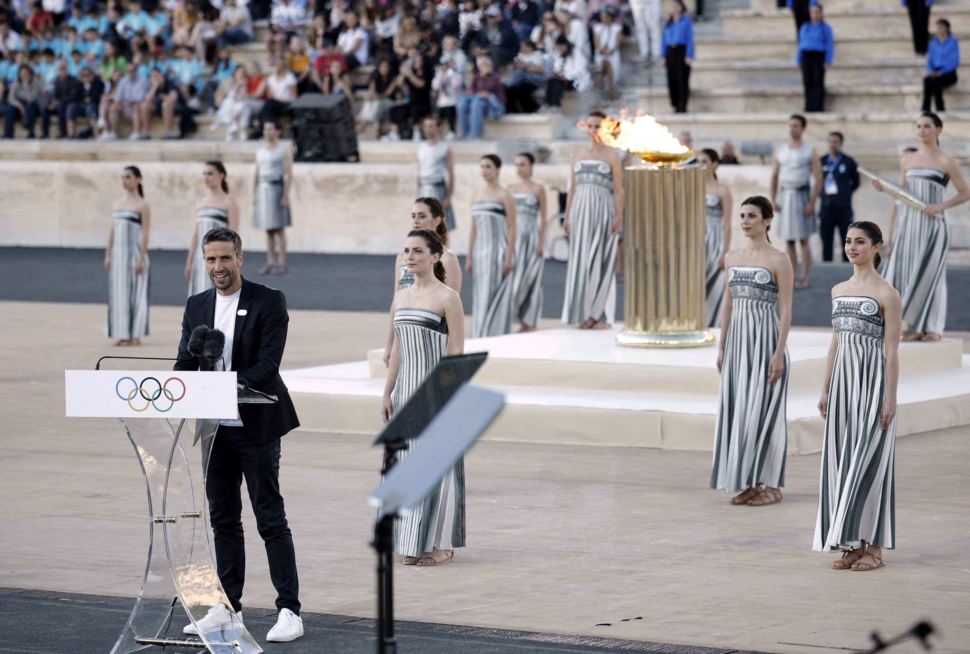 Paris organisers receive flame in Athens ahead of relay | Reuters