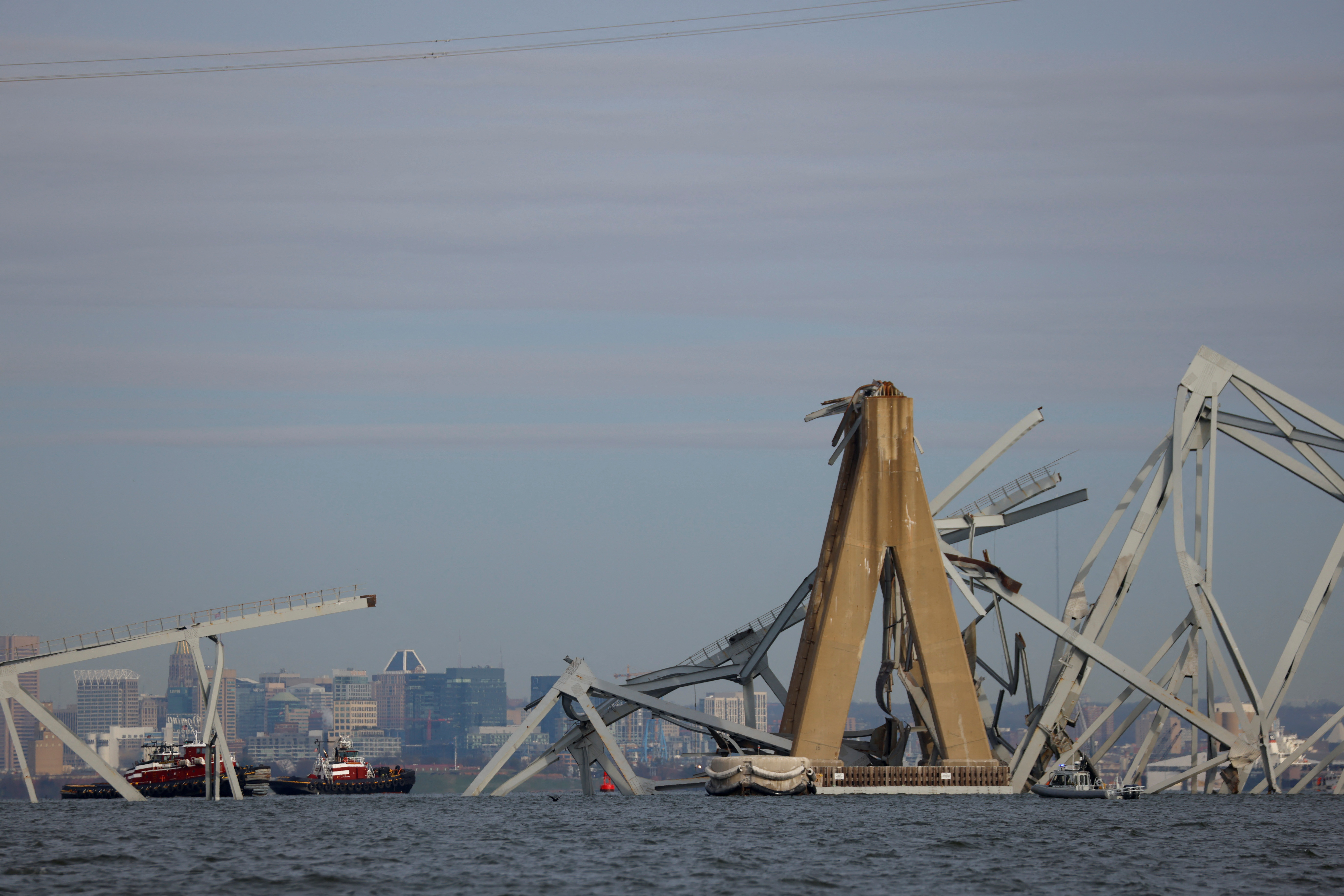 Baltimore bridge collapse sends vehicles tumbling into water - March 26 ...