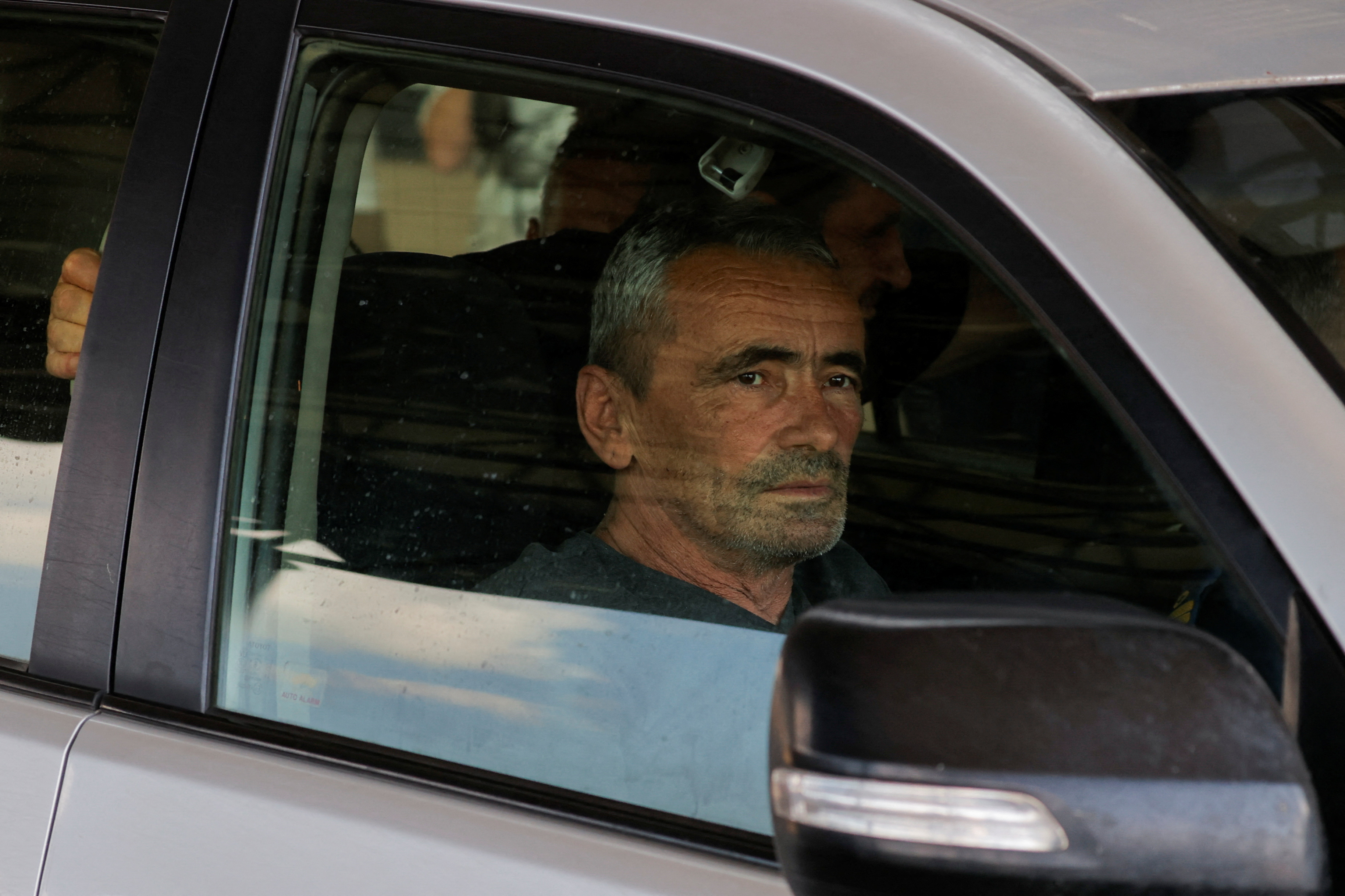 Serbia releases three detained Kosovo policemen, easing crisis | Reuters