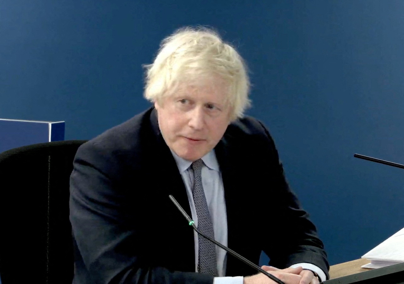 Former UK PM Johnson says sorry for loss of life during pandemic | Reuters