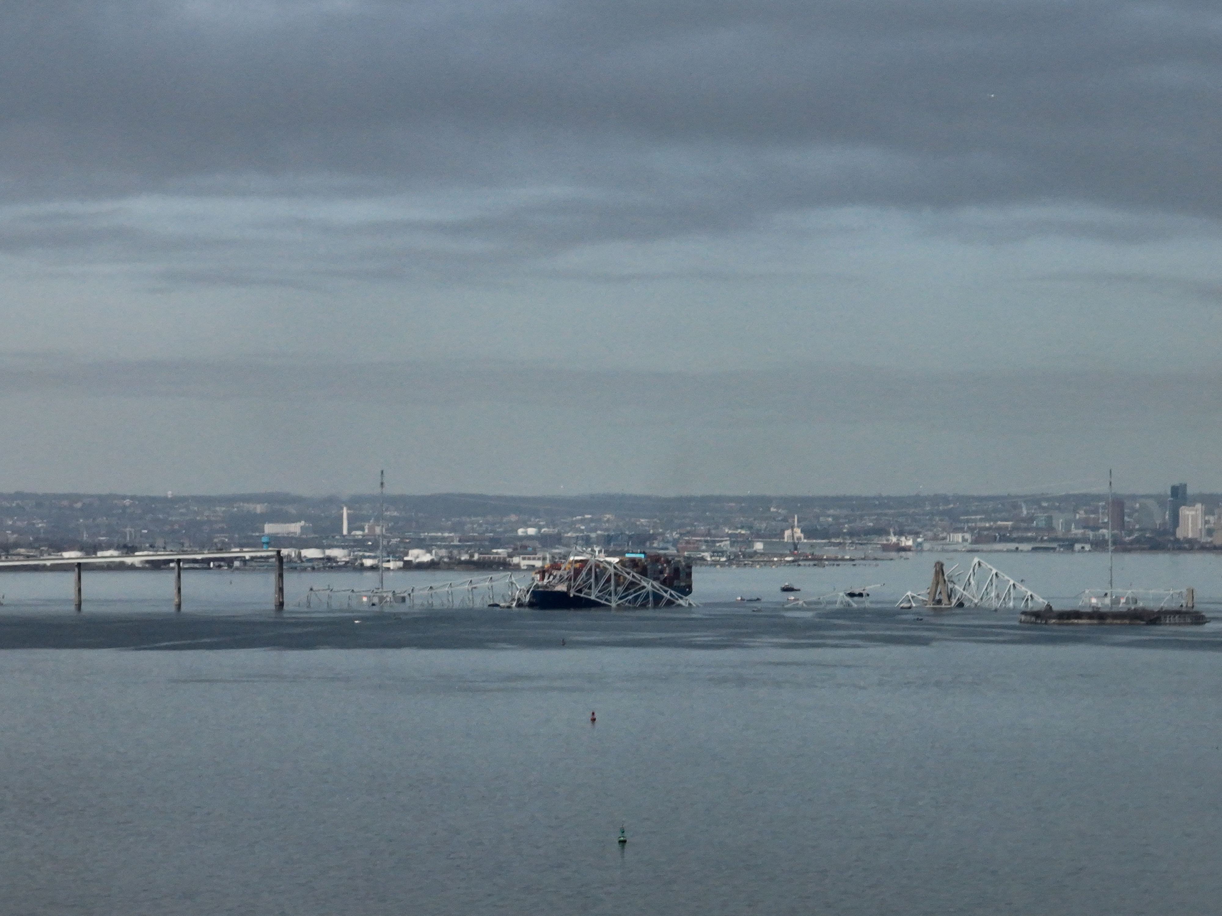 Baltimore bridge collapse sends vehicles tumbling into water - March 26 ...