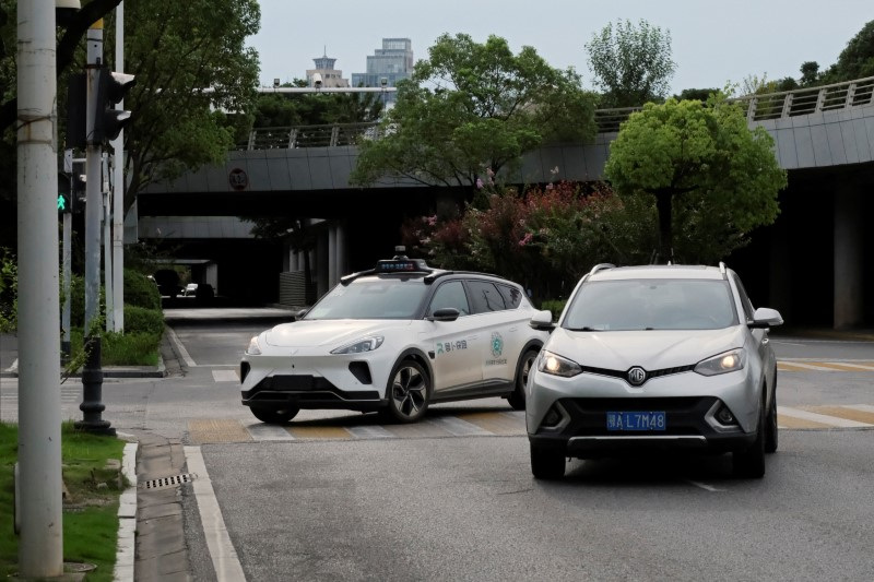 China's drivers fret as robotaxis pick up pace - and passengers | Reuters