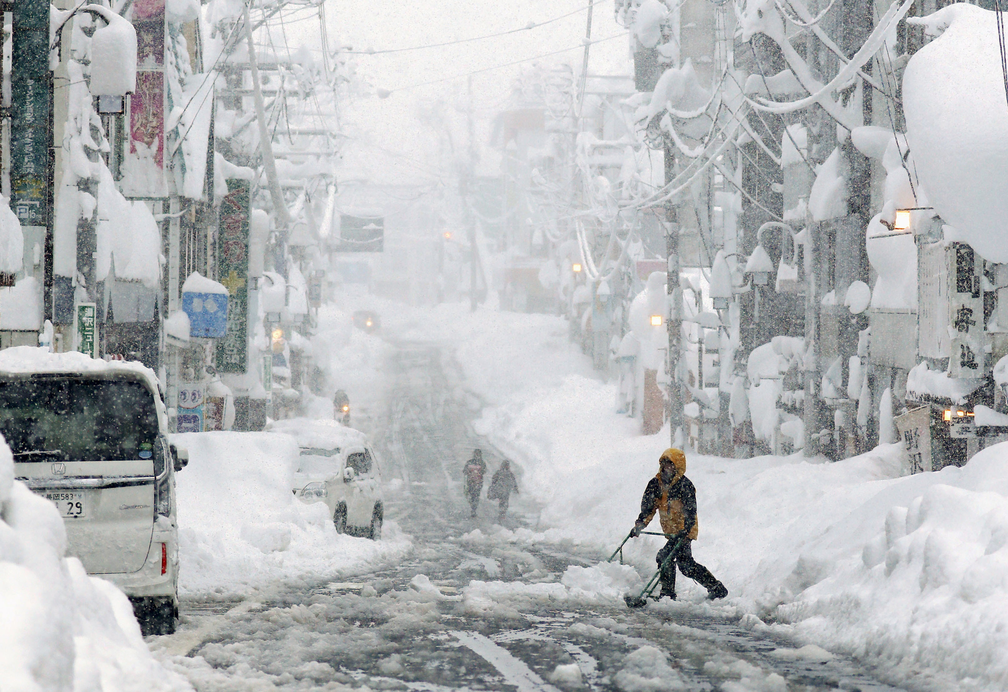 Heavy snowfall in Japan triggers power outages, isolates communities ...