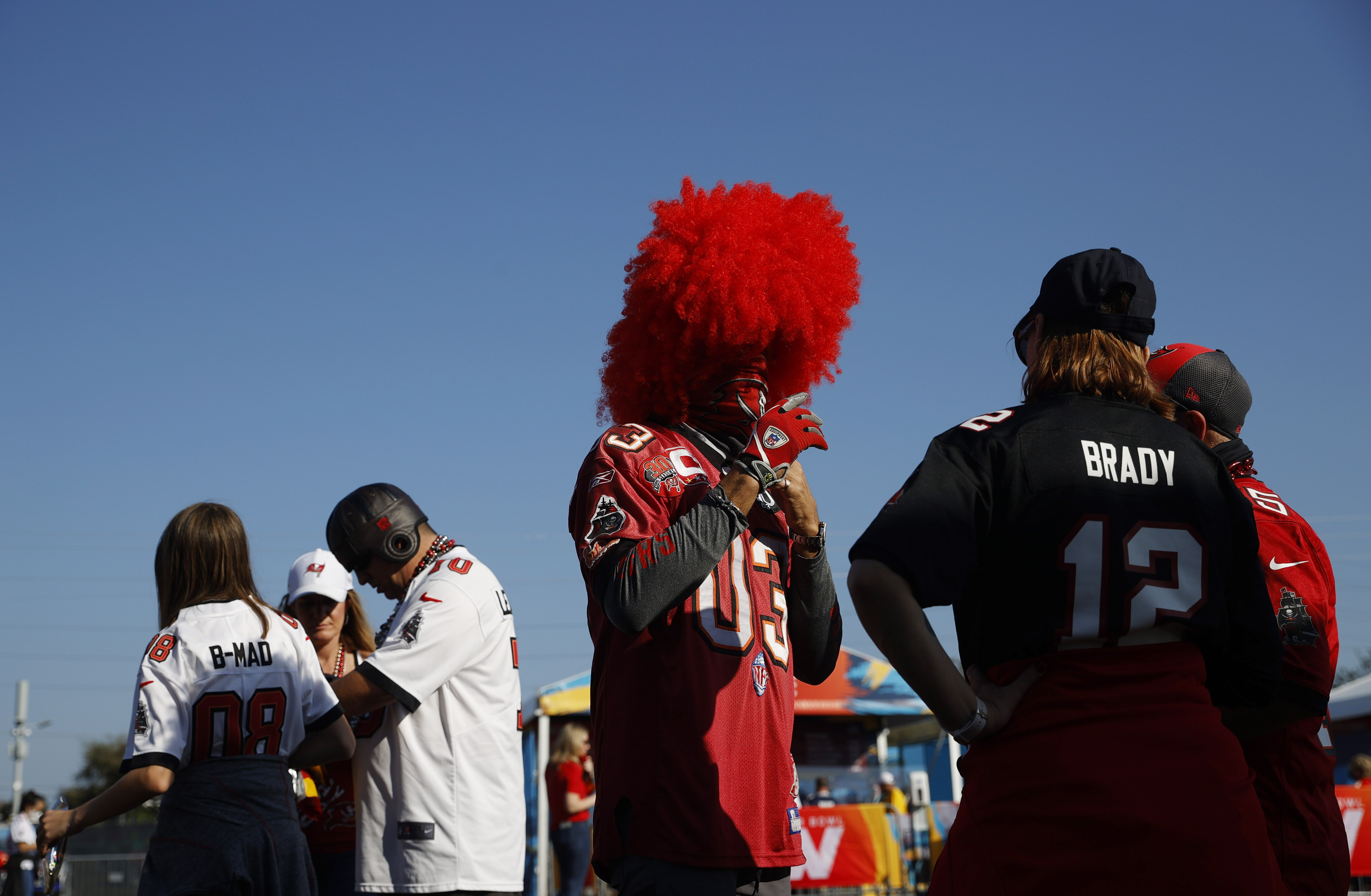 NFL Mask-clad fans stream into Buccaneers’ home stadium for Super Bowl ...