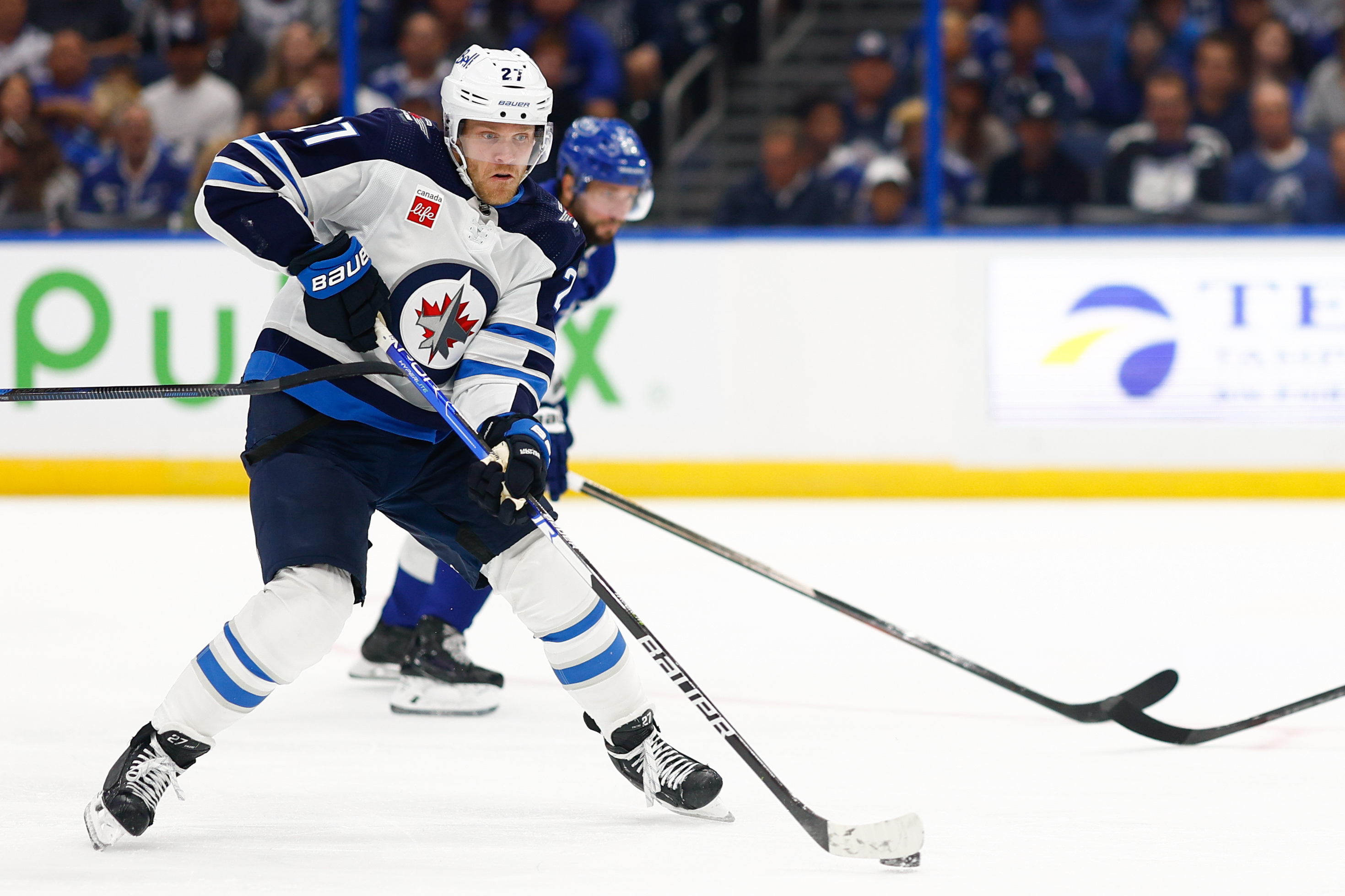 Adam Lowry leads Jets past Lightning in overtime | Reuters