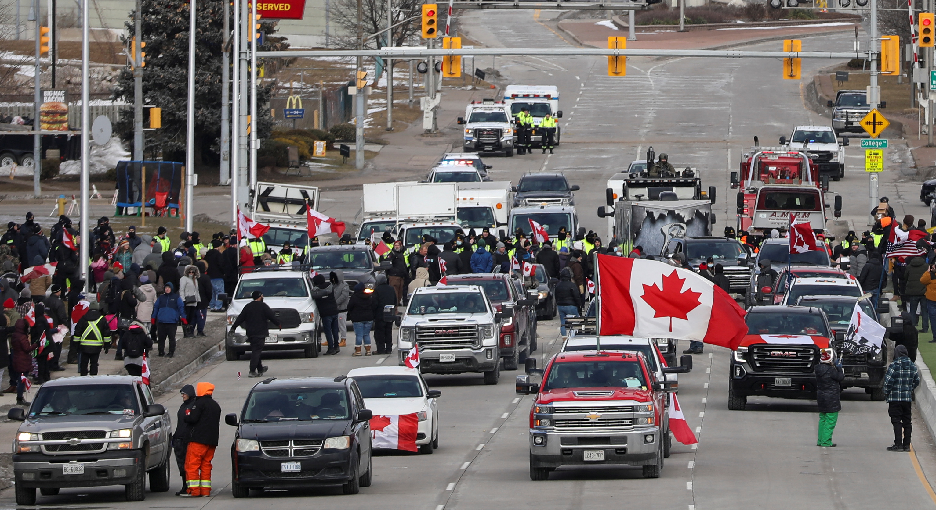 Canada police in standoff with protesters blocking bridge to U.S. | Reuters