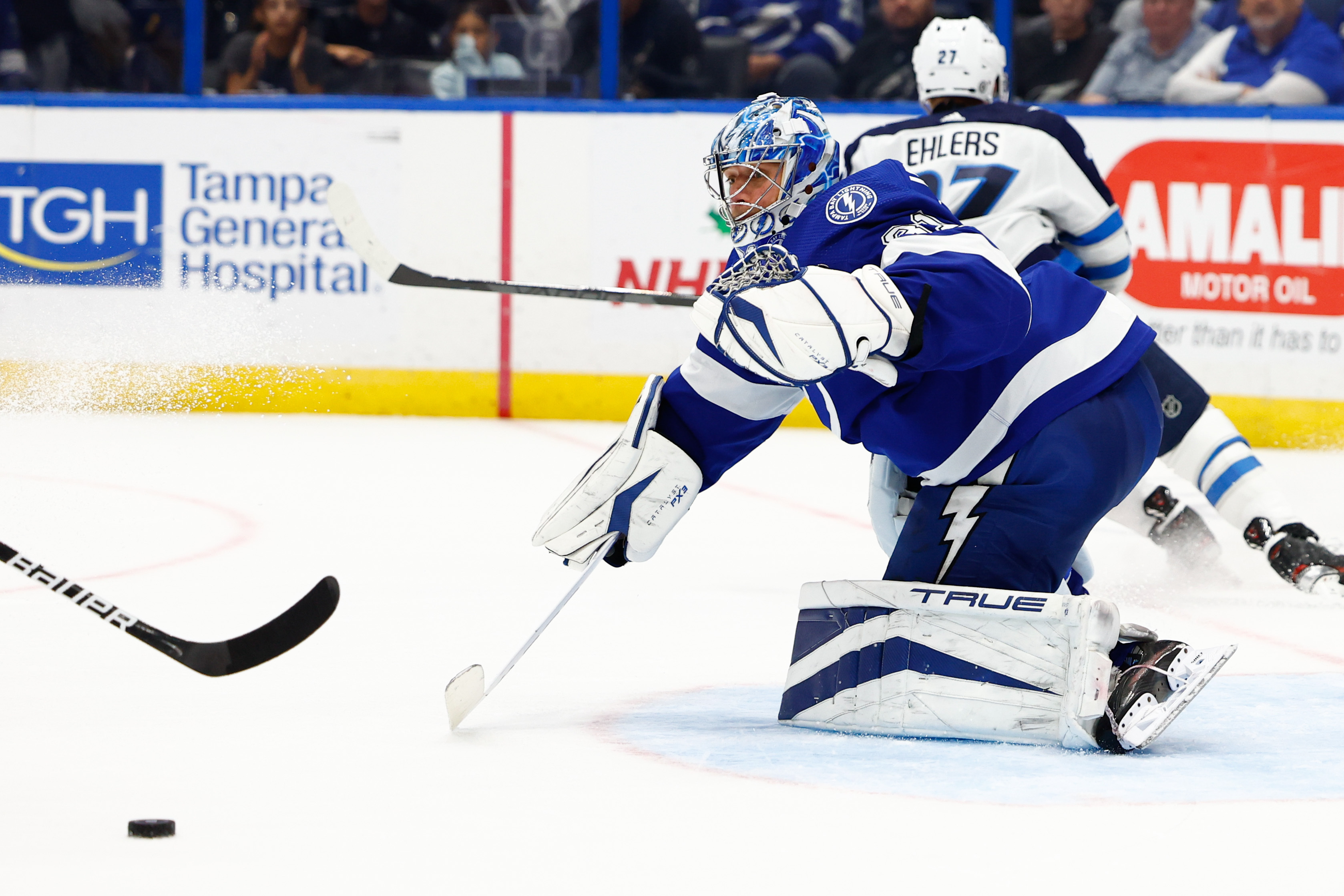 Adam Lowry leads Jets past Lightning in overtime | Reuters