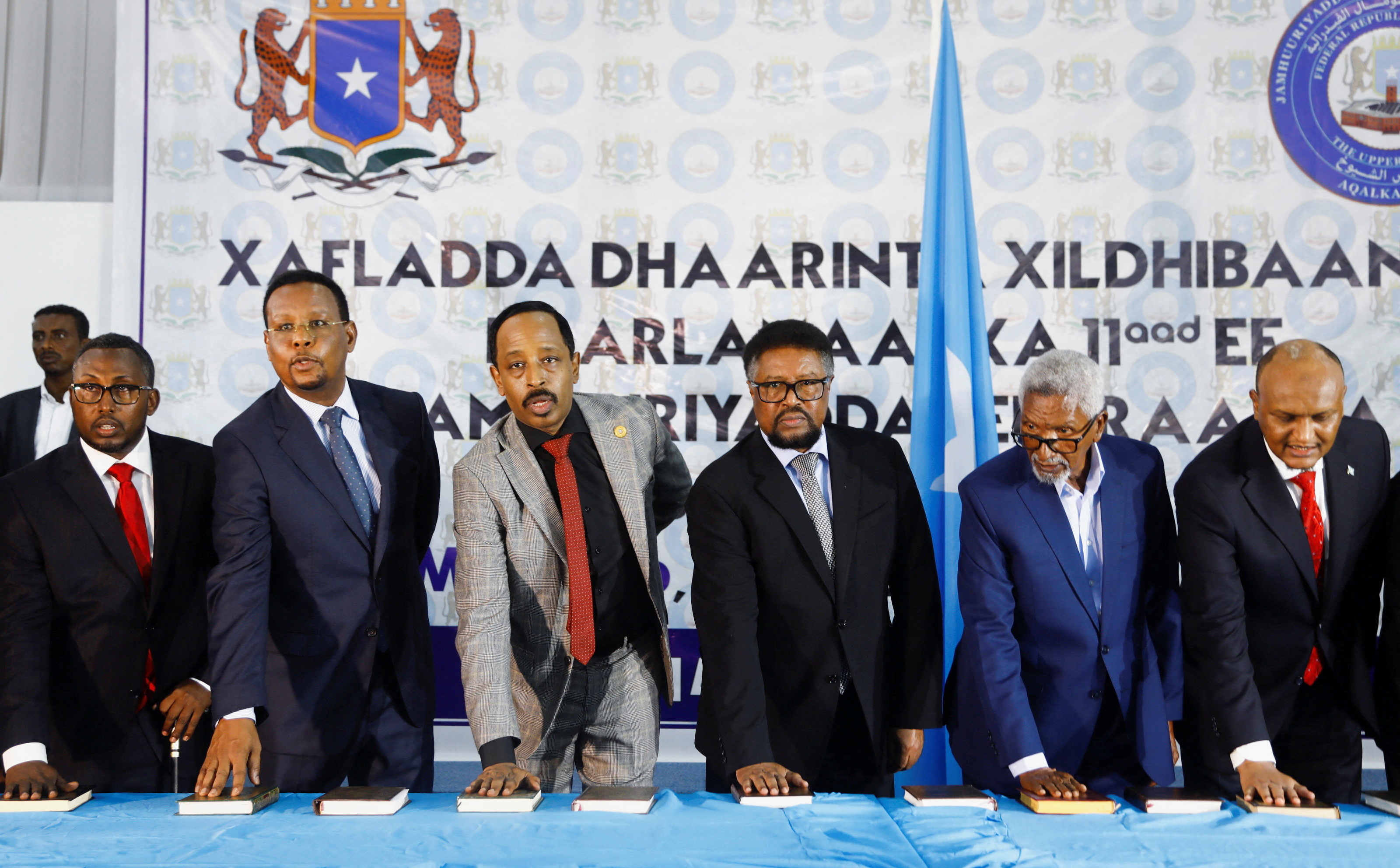 Somalia swears in lawmakers, paving way for presidential vote | Reuters