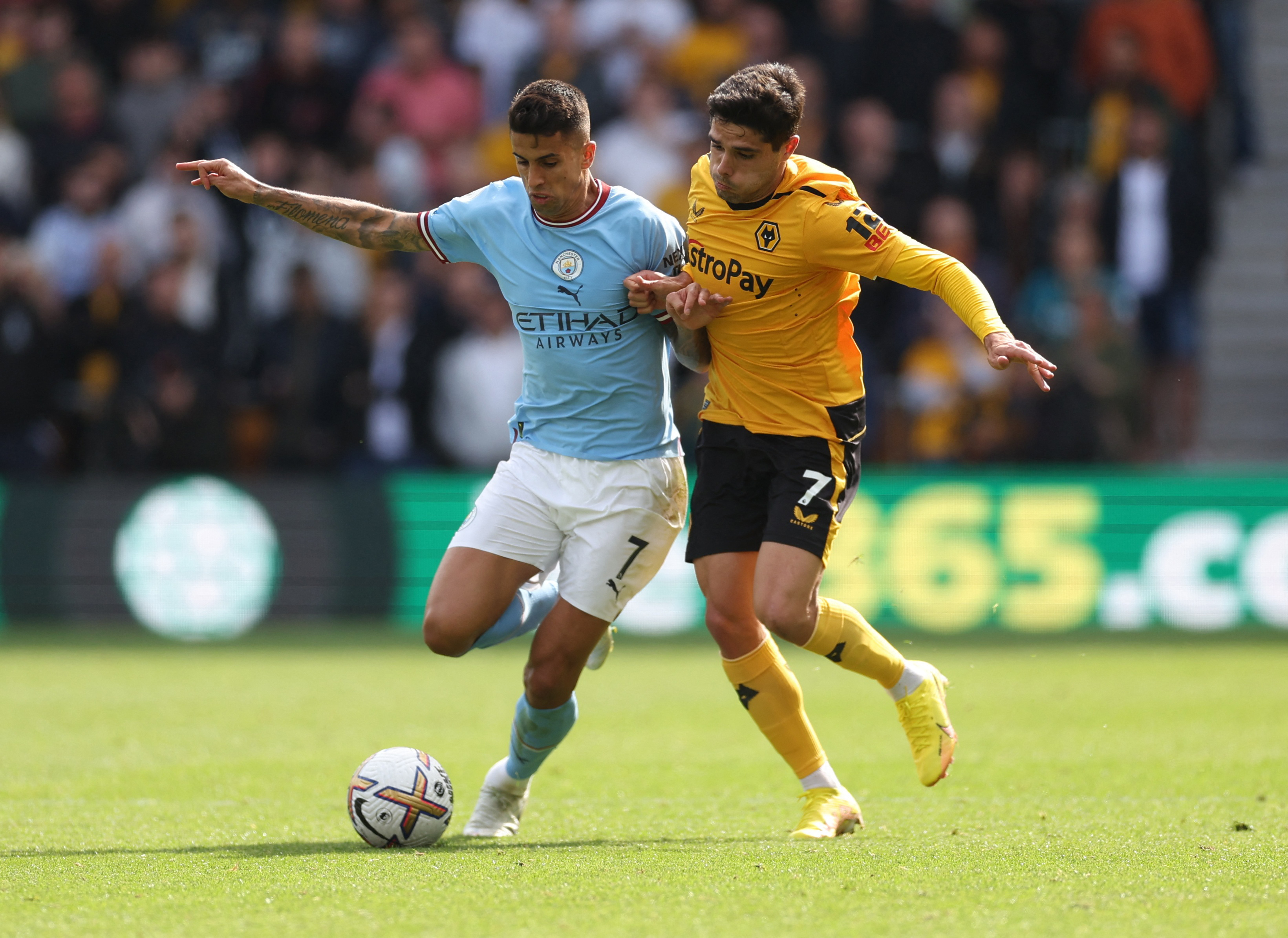 Early Grealish, Haaland goals ease Man City to win at 10-man Wolves ...
