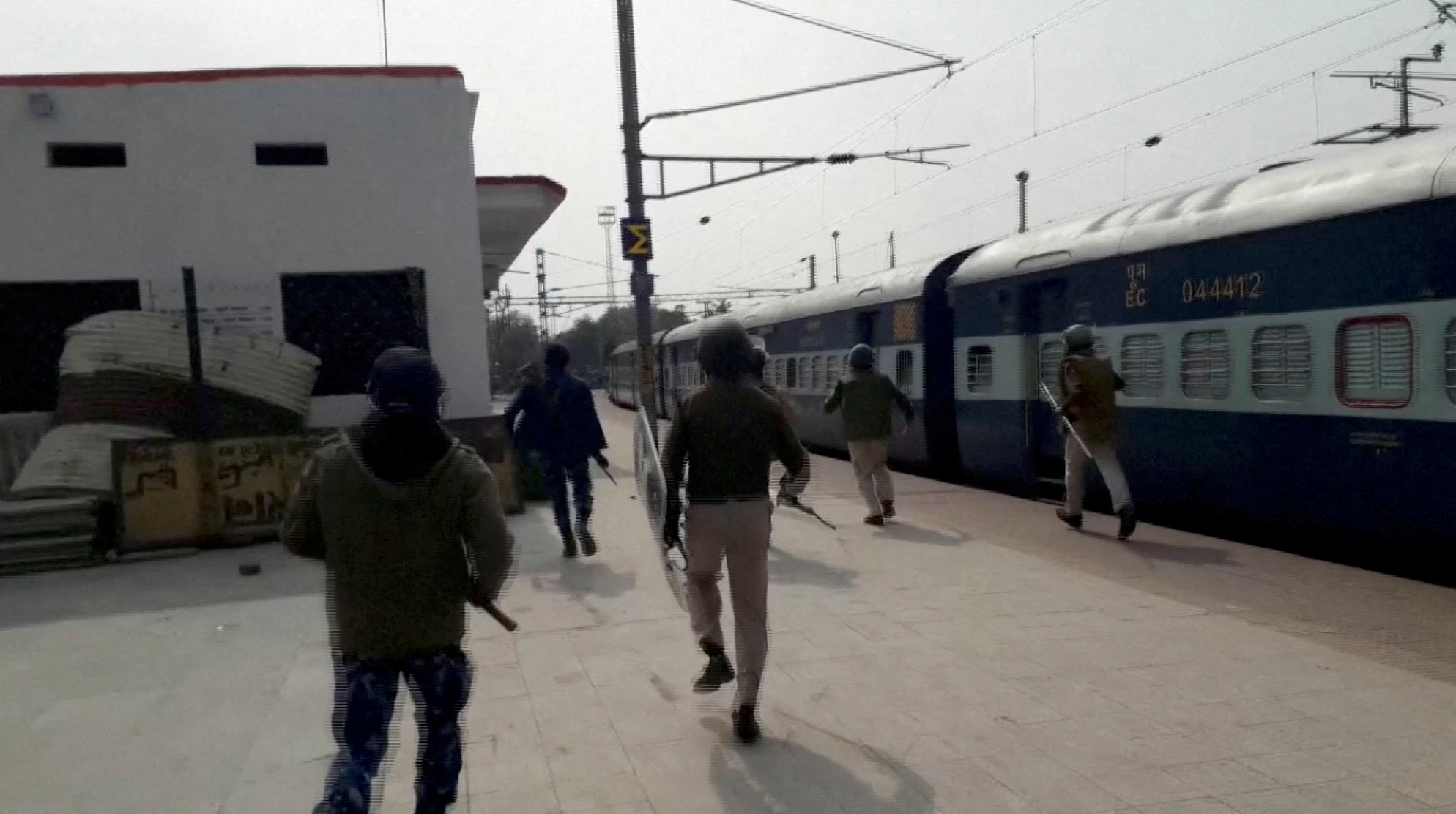 Job-seekers burn train coaches in India after alleged flaws in railway ...