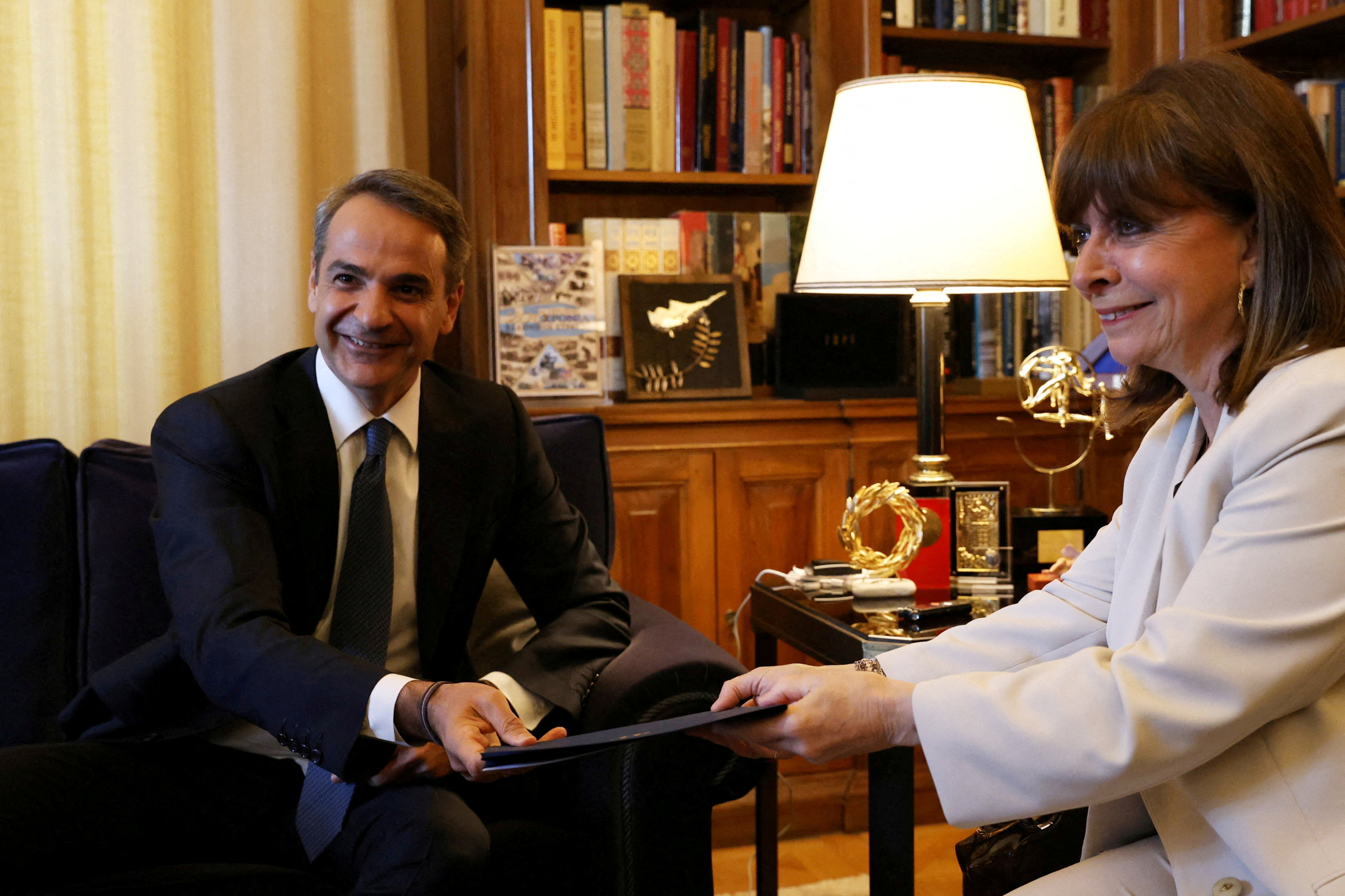 Greek president approves PM request for May 21 election | Reuters