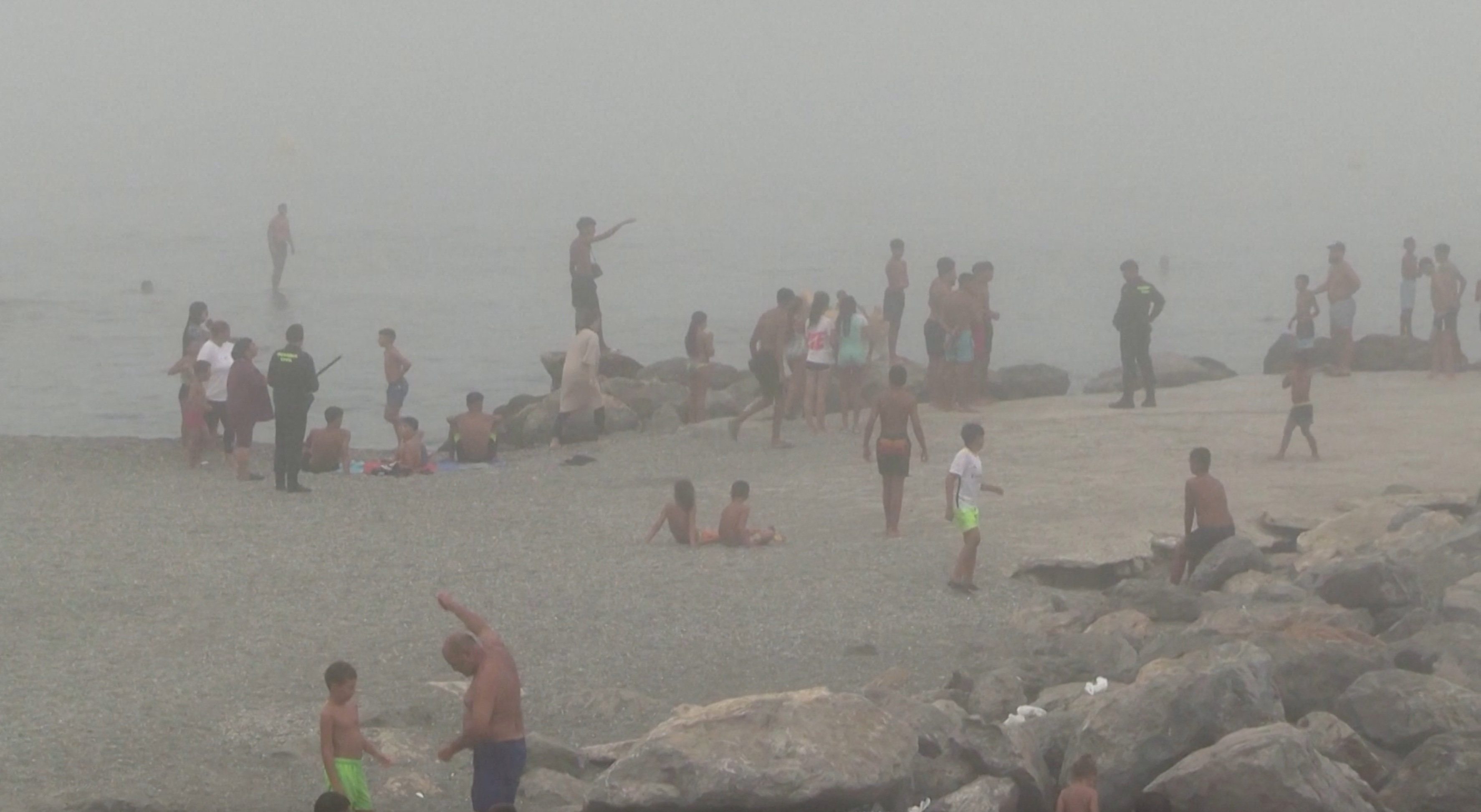 Hundreds of migrants swim into Spain's Ceuta enclave from Morocco | Reuters