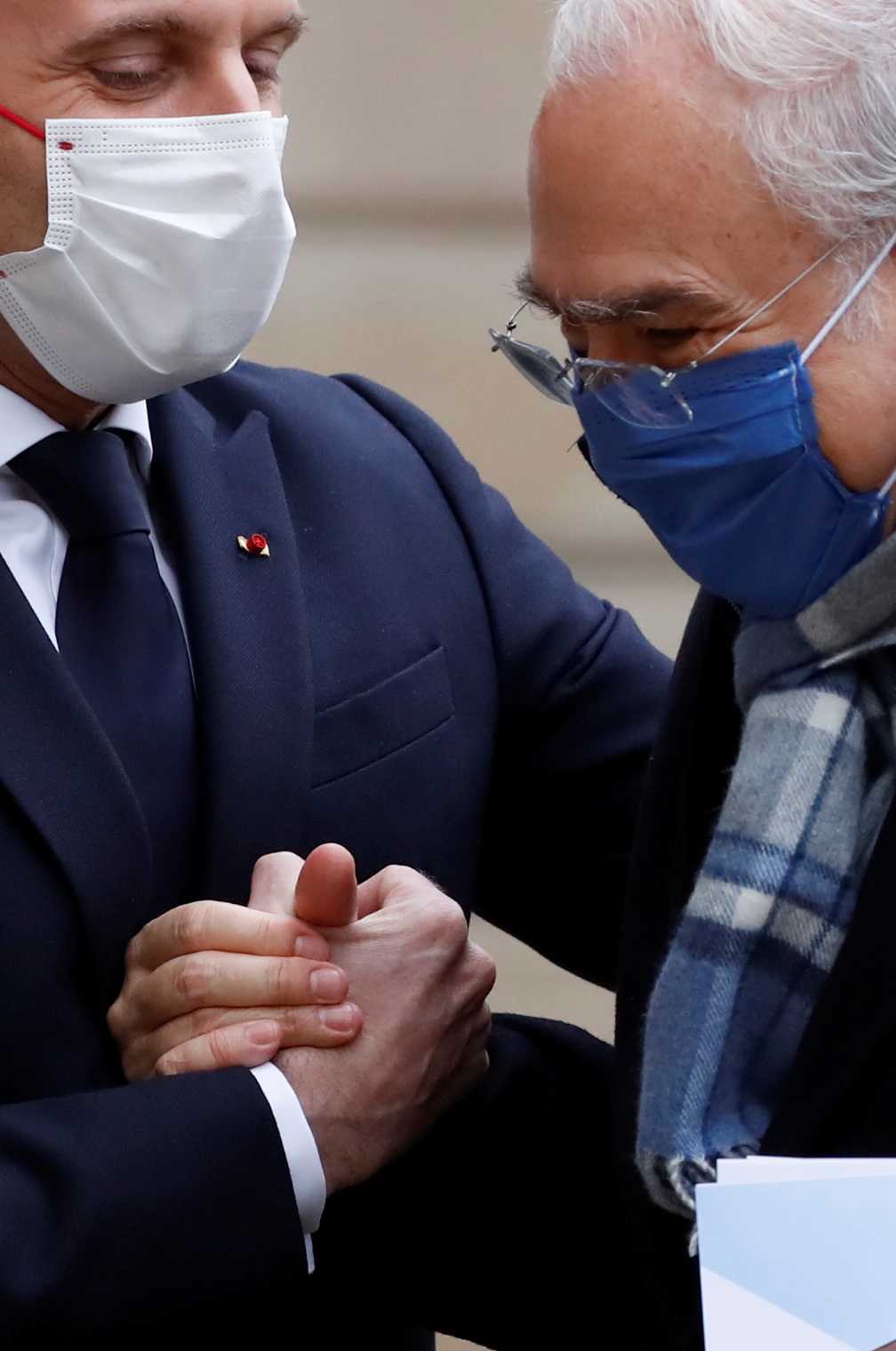 From bows to handshakes, how Macron let social distancing slip | Reuters