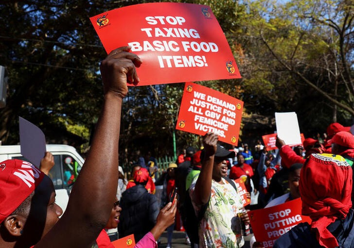 S.Africa's COSATU leads union protests over high cost of living | Reuters