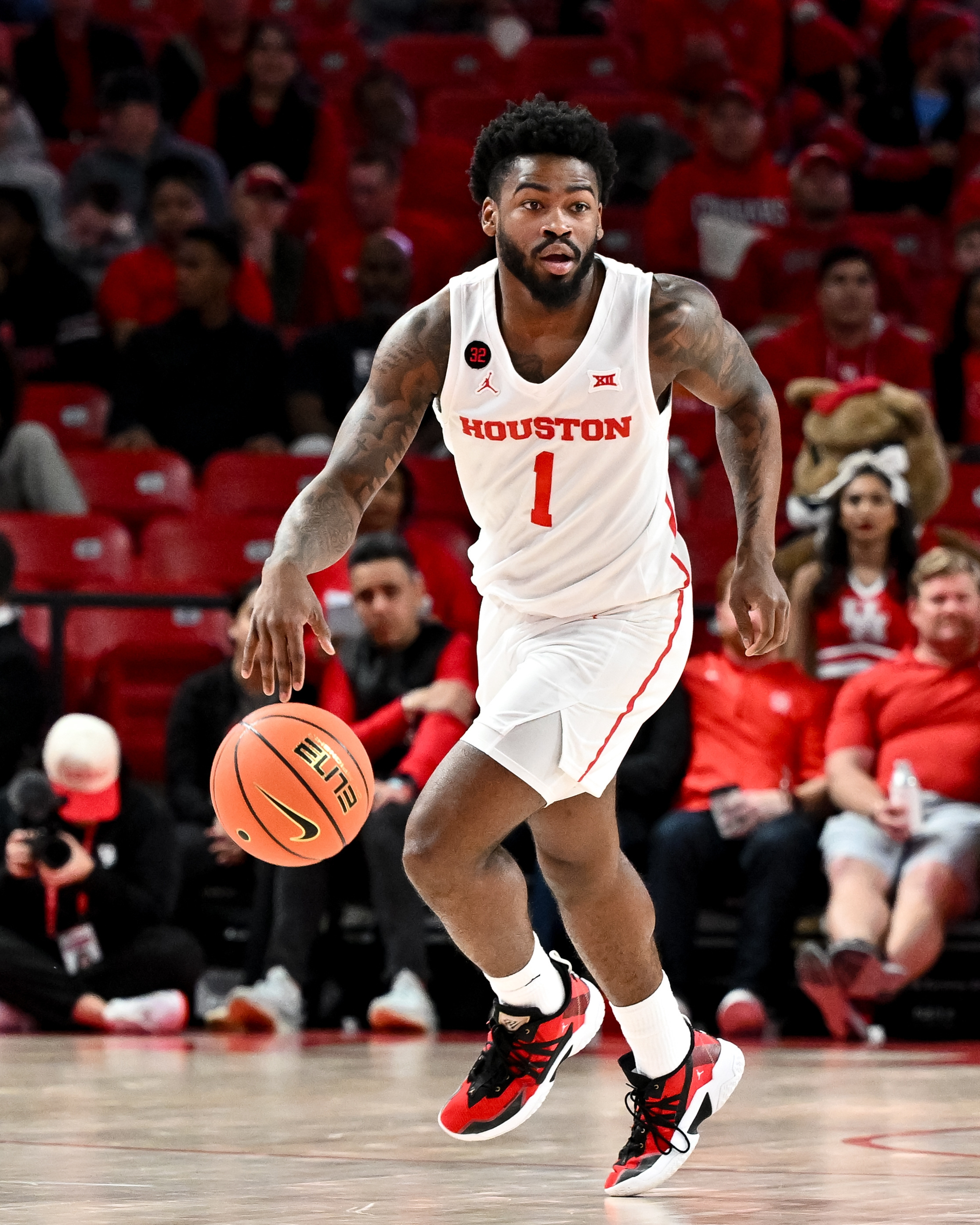 L.J. Cryer hits milestone as No. 3 Houston blitzes Penn | Reuters