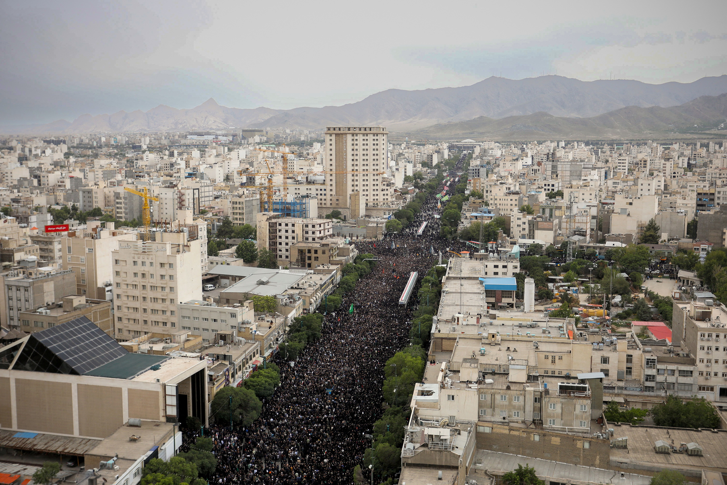 Iran's Raisi buried in Mashhad as mourners pack Iranian holy city | Reuters