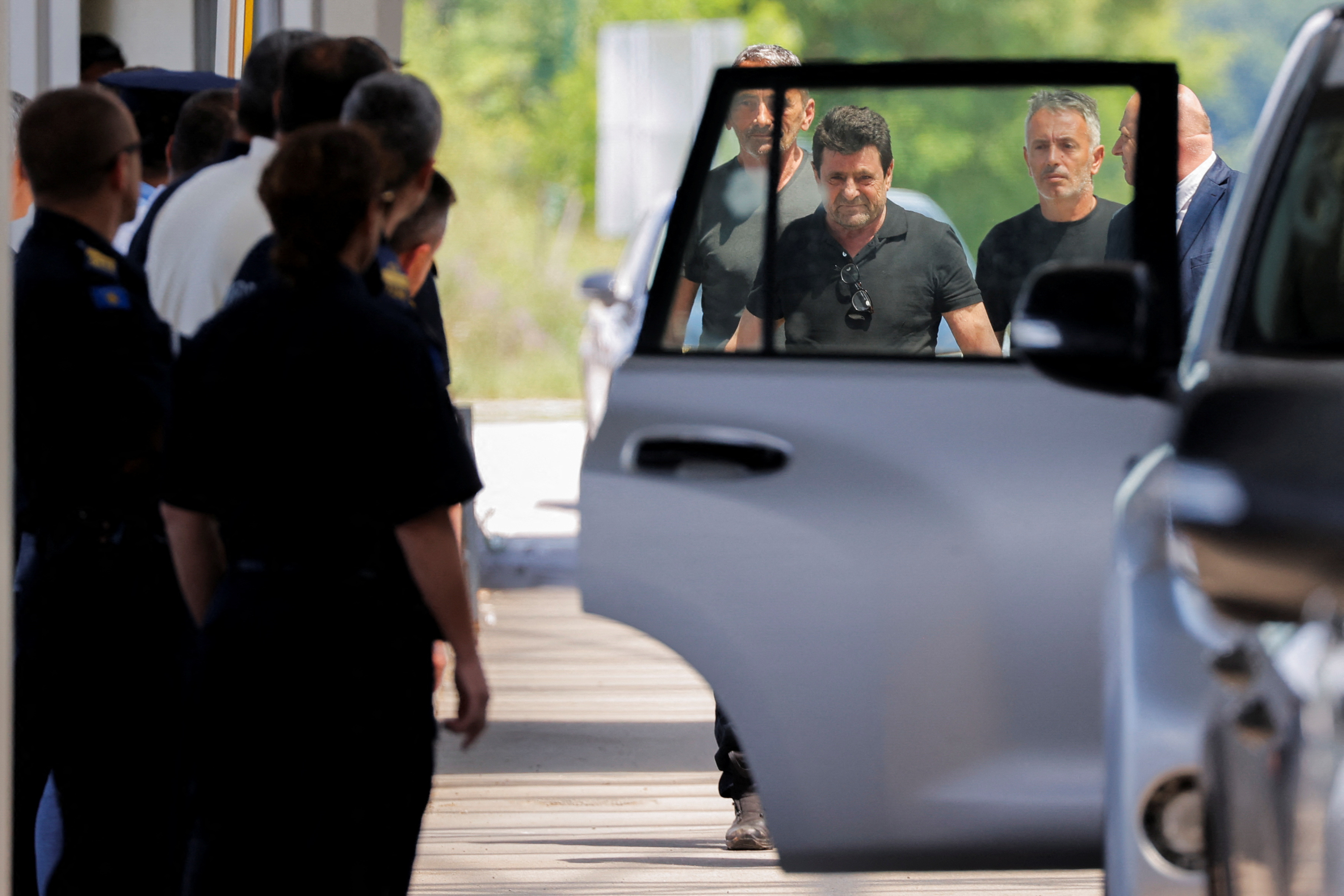 Serbia releases three detained Kosovo policemen, easing crisis | Reuters