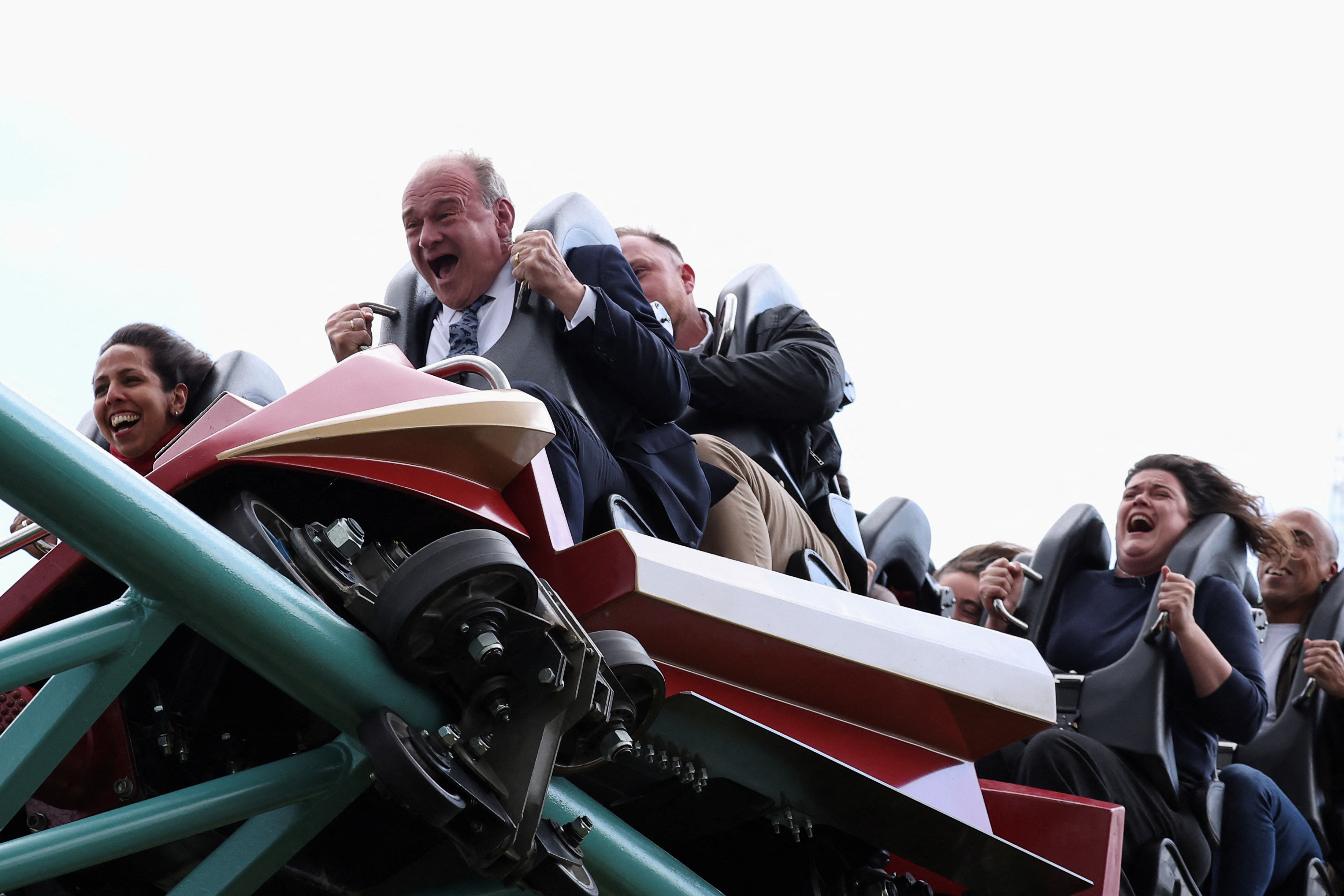 Splashing and sliding Lib Dem leader brings fun to UK election | Reuters