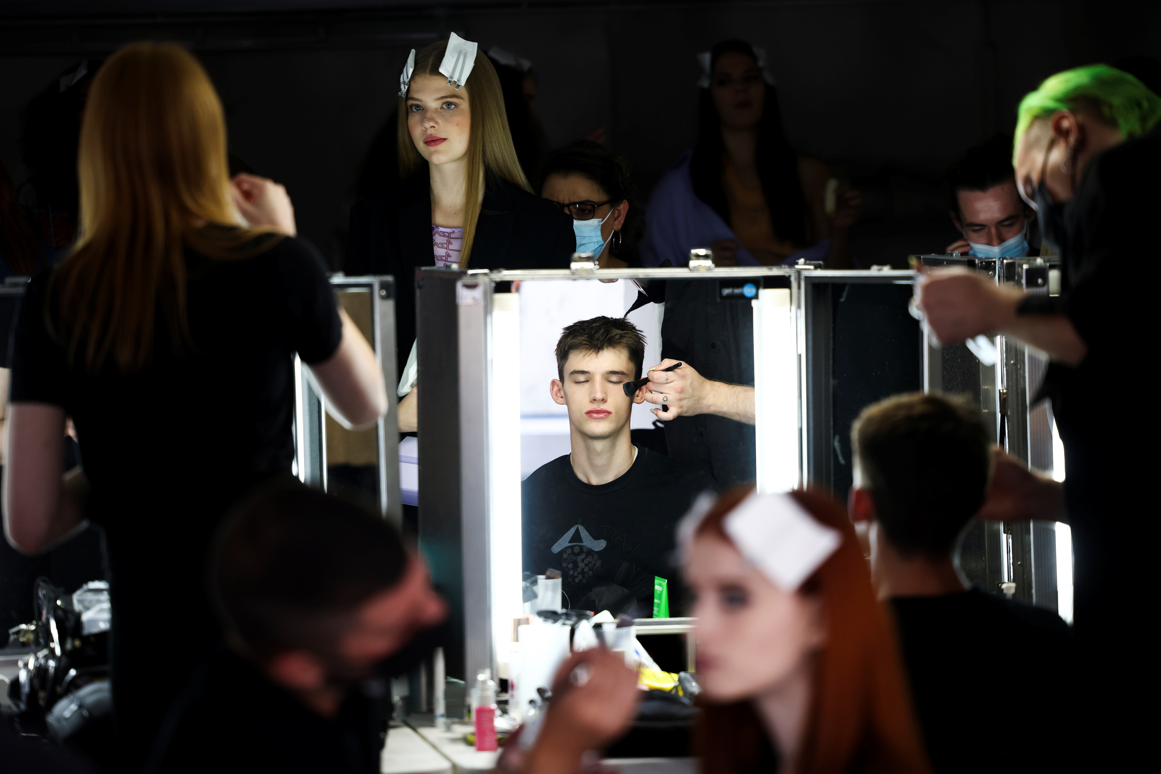 Colourful catwalk shows return at hybrid London Fashion Week | Reuters