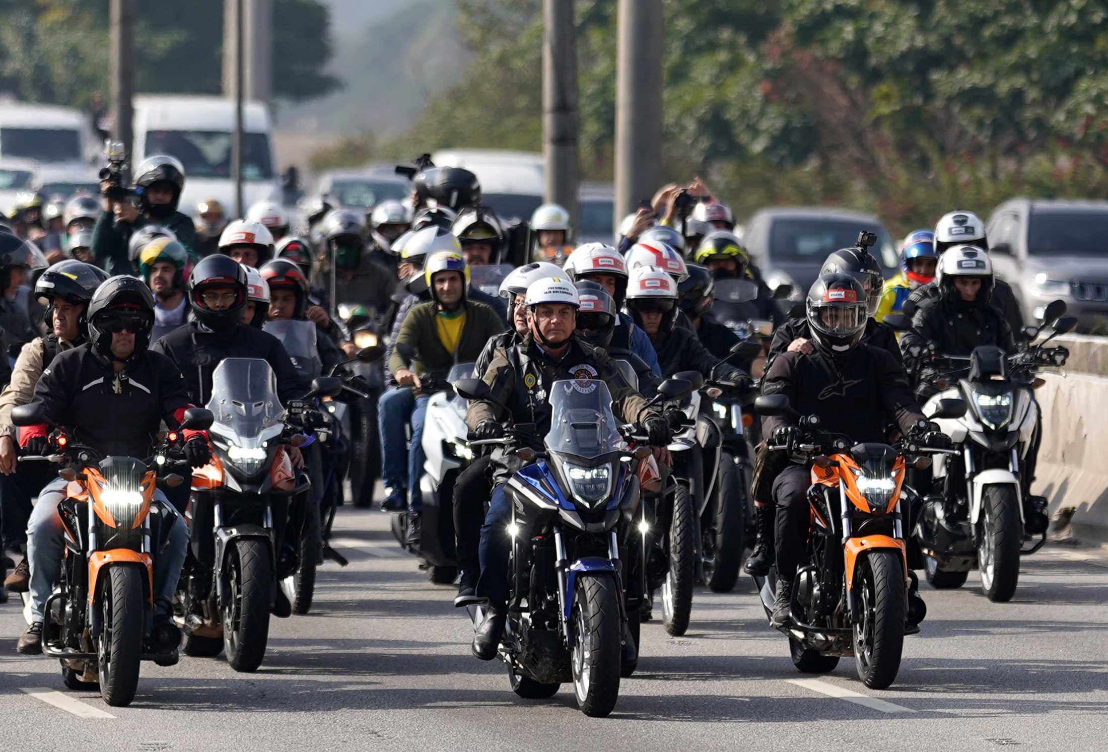 At biker rally, Brazil's Bolsonaro says cops will support him 'whatever ...