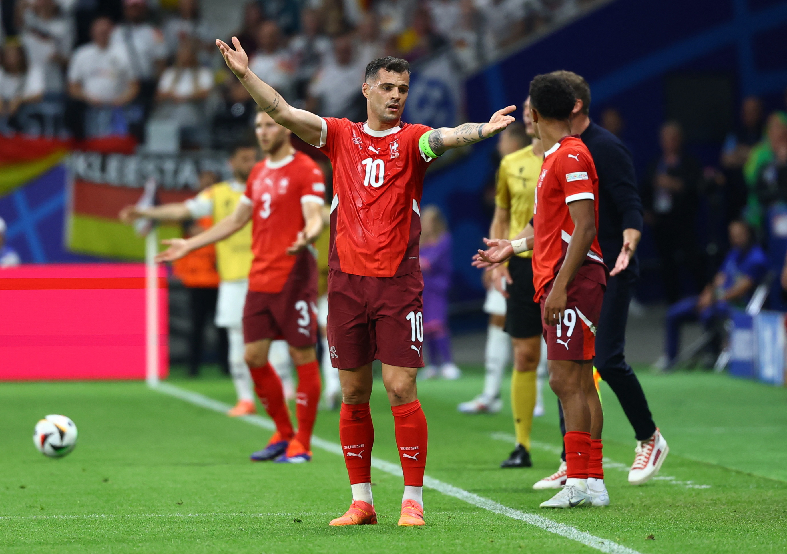 Xhaka hails revamped Swiss after reaching knockout stages again | Reuters