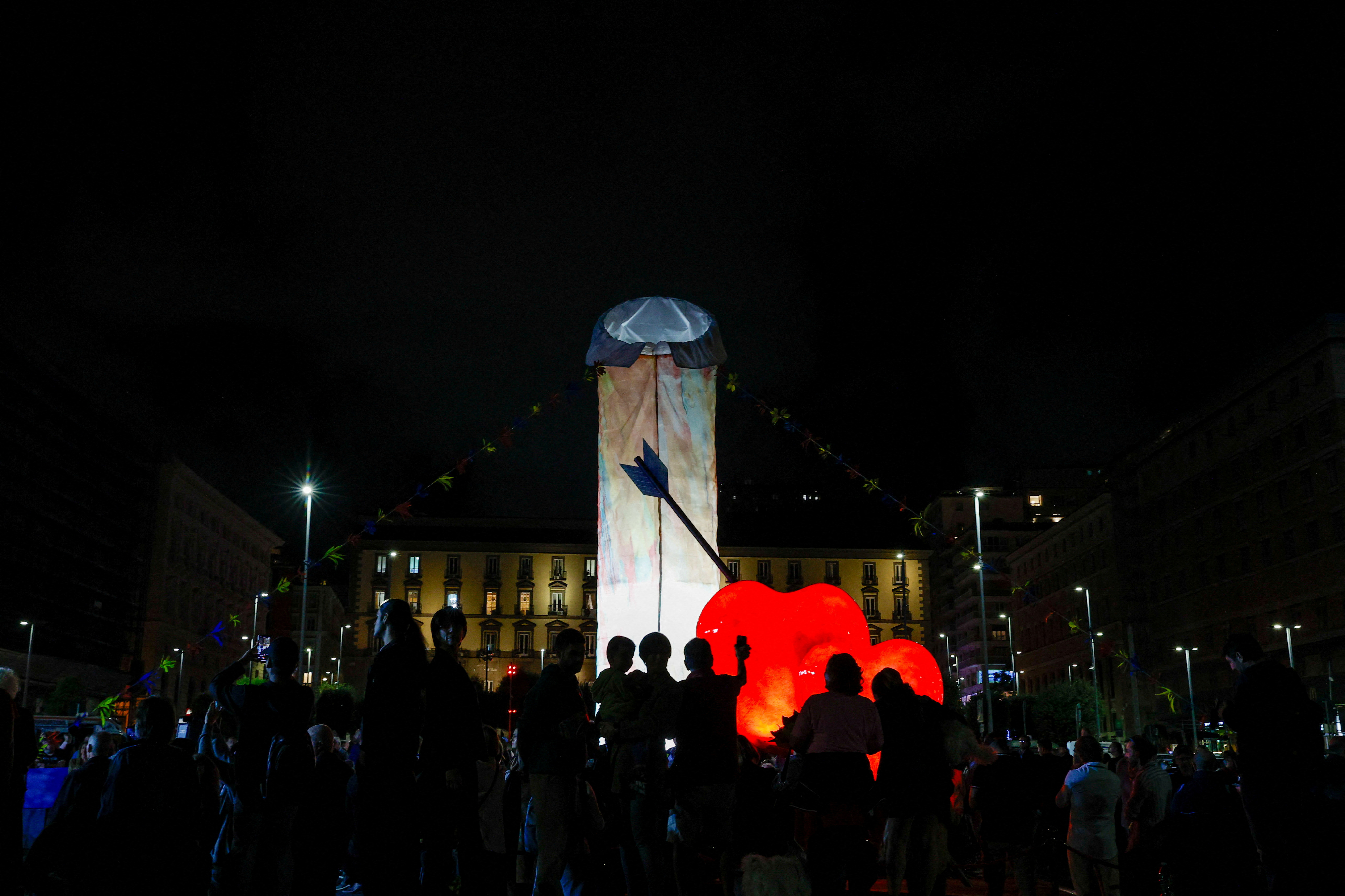 Phallic 12-metre art installation raises eyebrows in Naples | Reuters