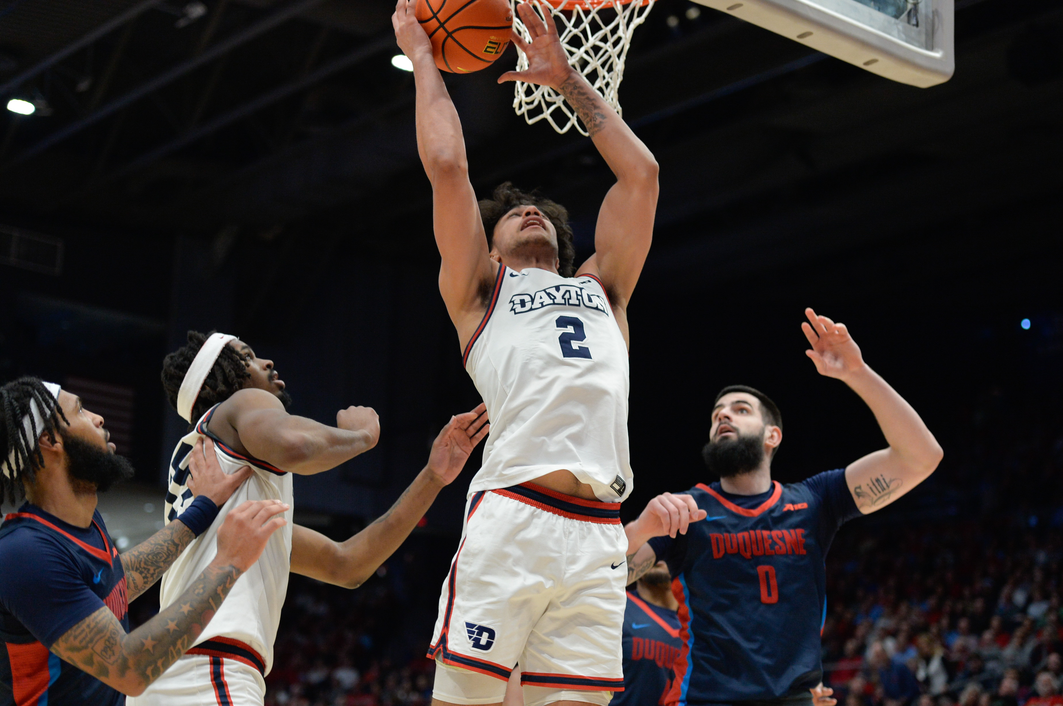 DaRon Holmes II powers No. 16 Dayton past Duquesne | Reuters